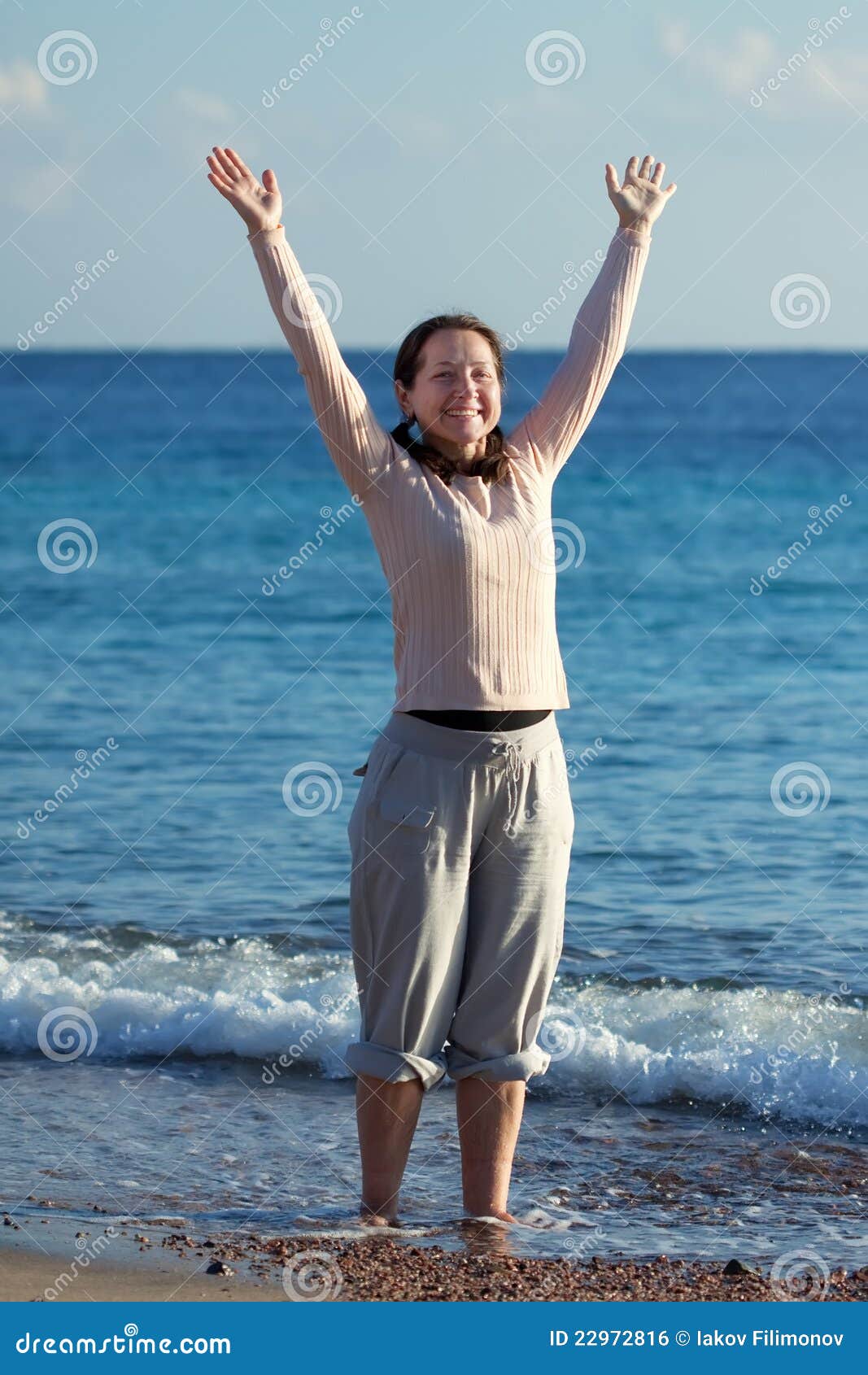 Happy Mature Woman on Sandy Beach Stock Photo - Image of seaside, ocean ...
