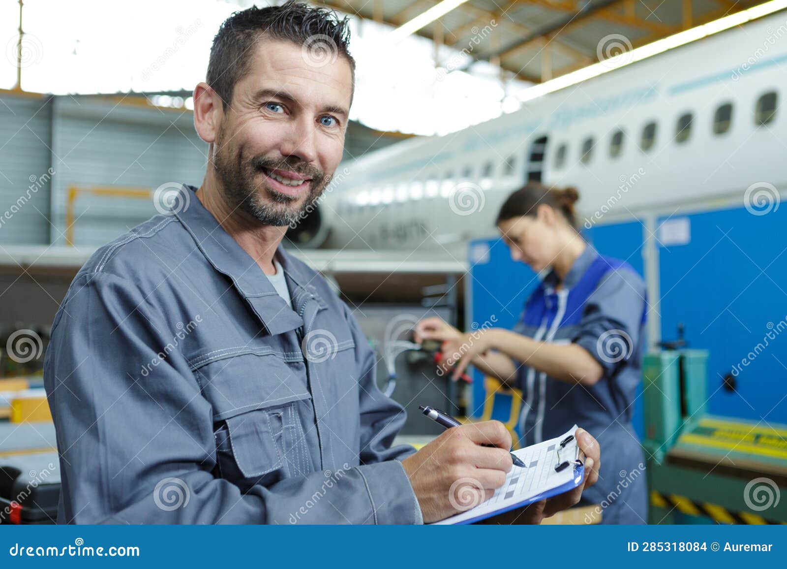 Happy Mechanic Man with Clipboard in Workshop Stock Photo - Image of ...