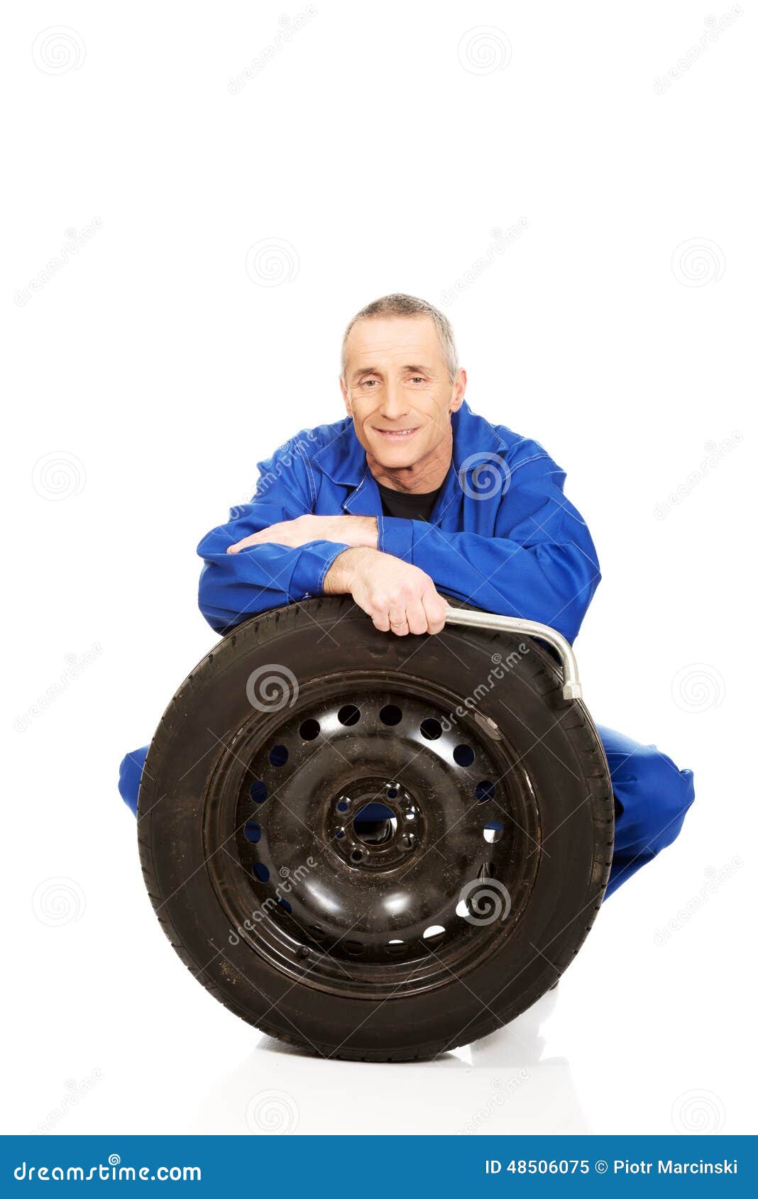 Happy Mechanic with a Tire and Wrench Stock Image - Image of blue, tyre ...