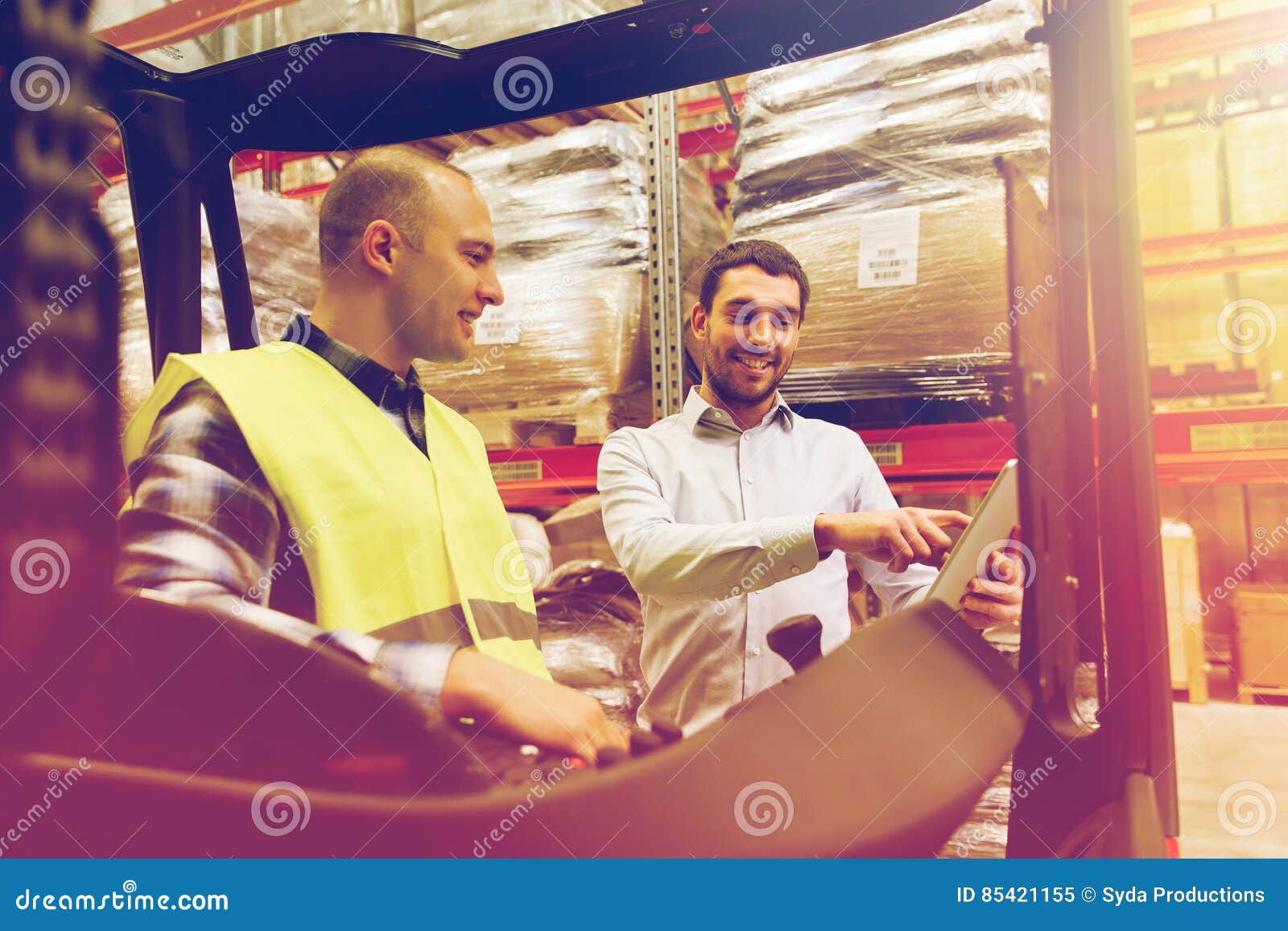 Smiling Loader Transporting Cargo On Wheeled Cart In Storehouse Stock ...