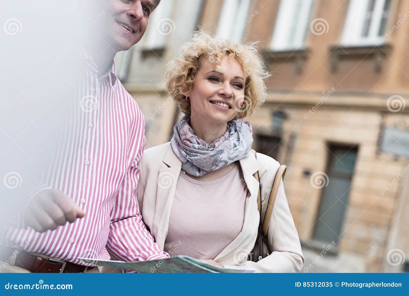 Happy Middle-aged Couple with Map in City Stock Image - Image of front ...