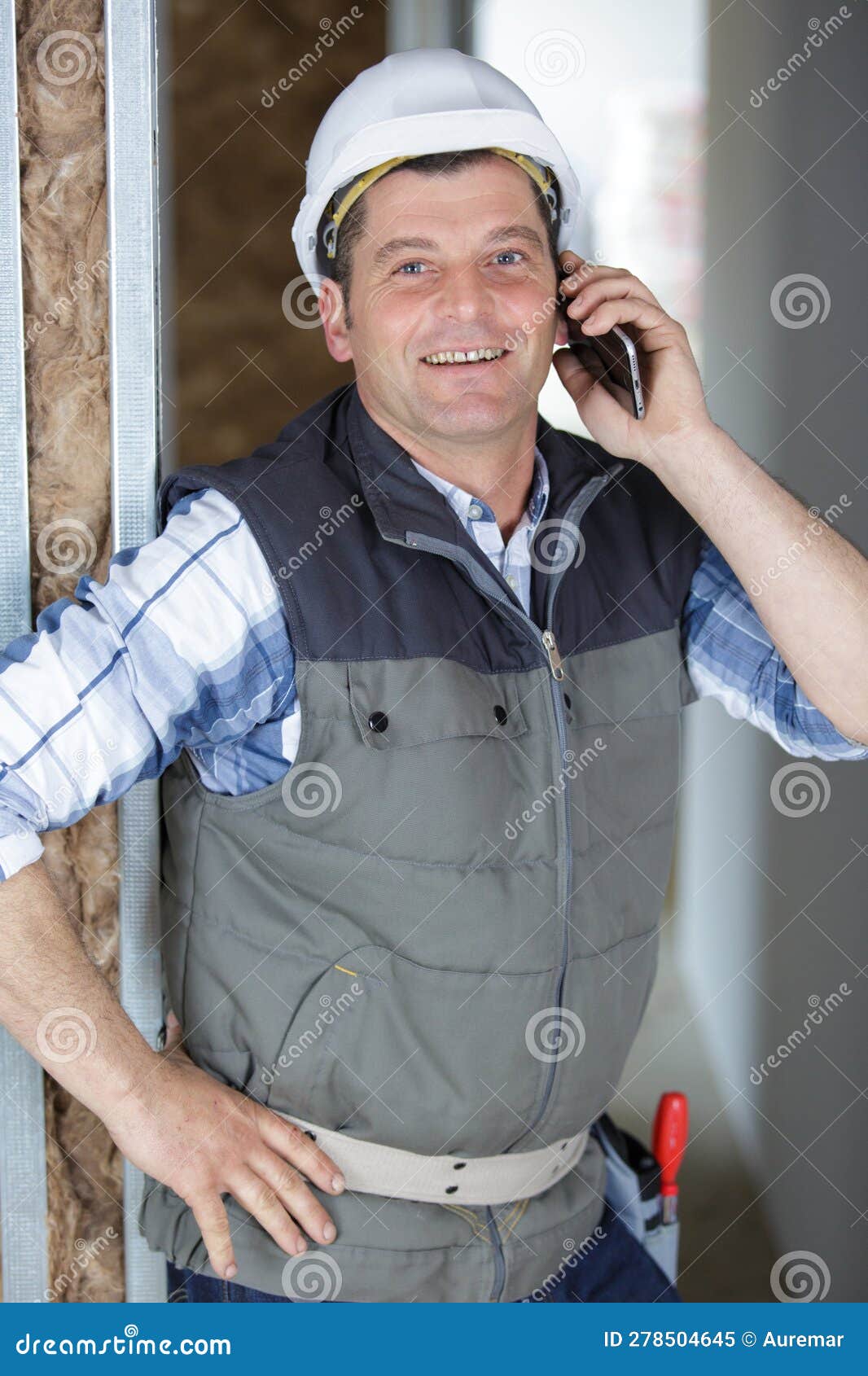 Happy Middle Aged Handyman Talking on Mobile Phone Stock Image - Image ...