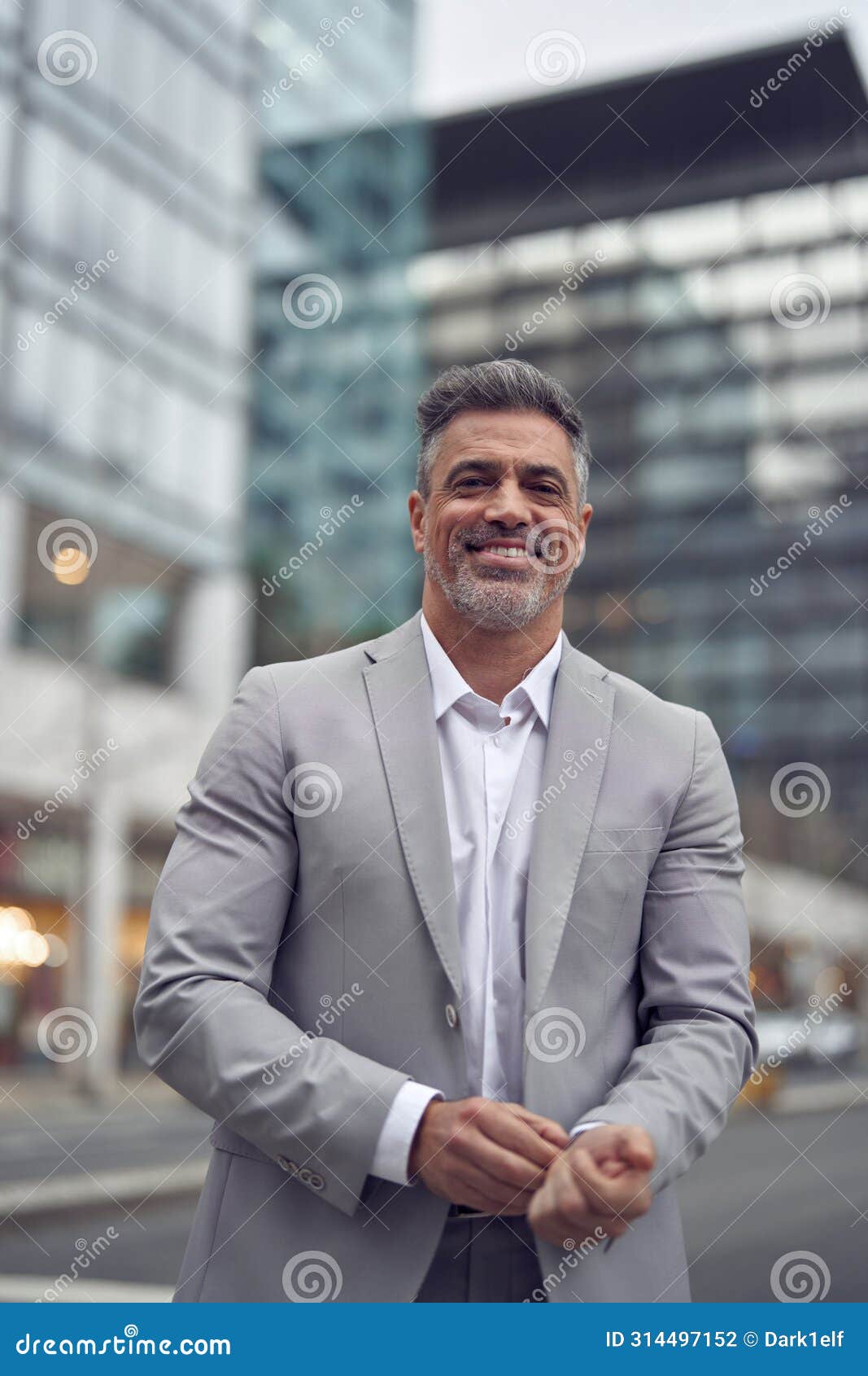 Happy Mature Business Man Wearing Suit Standing On City Street