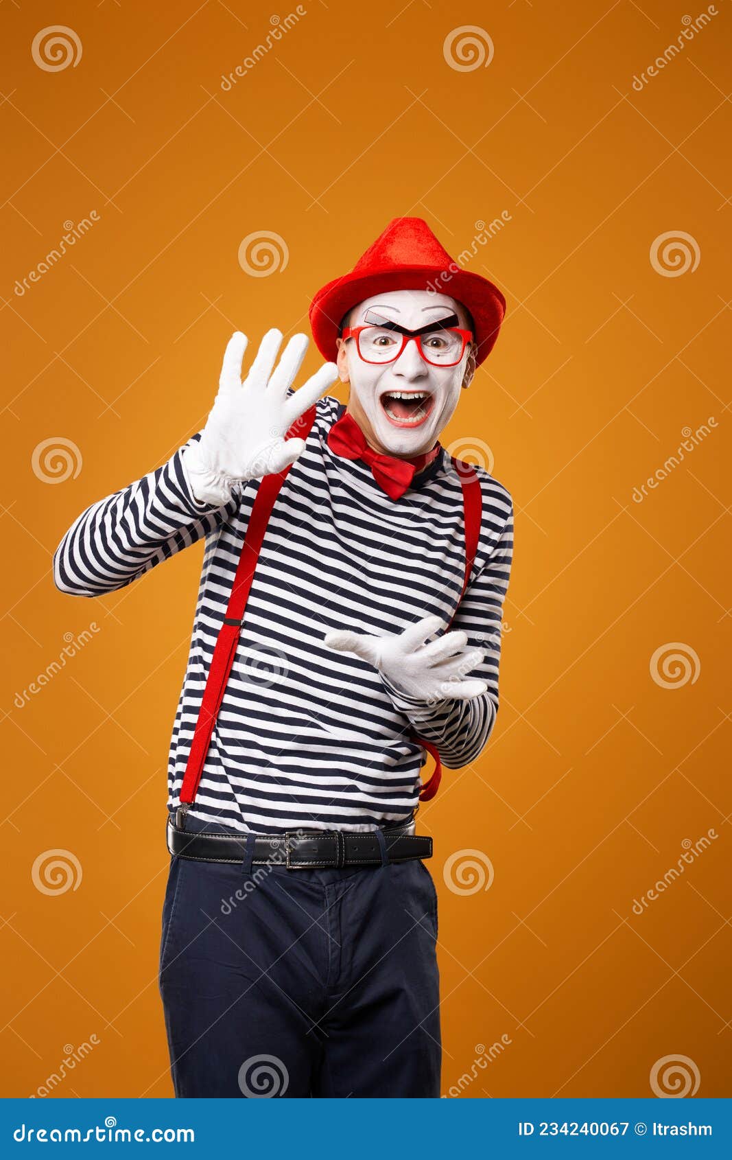 Happy Mime Man Looking at Camera in Vest and Red Hat Isolated on Orange ...