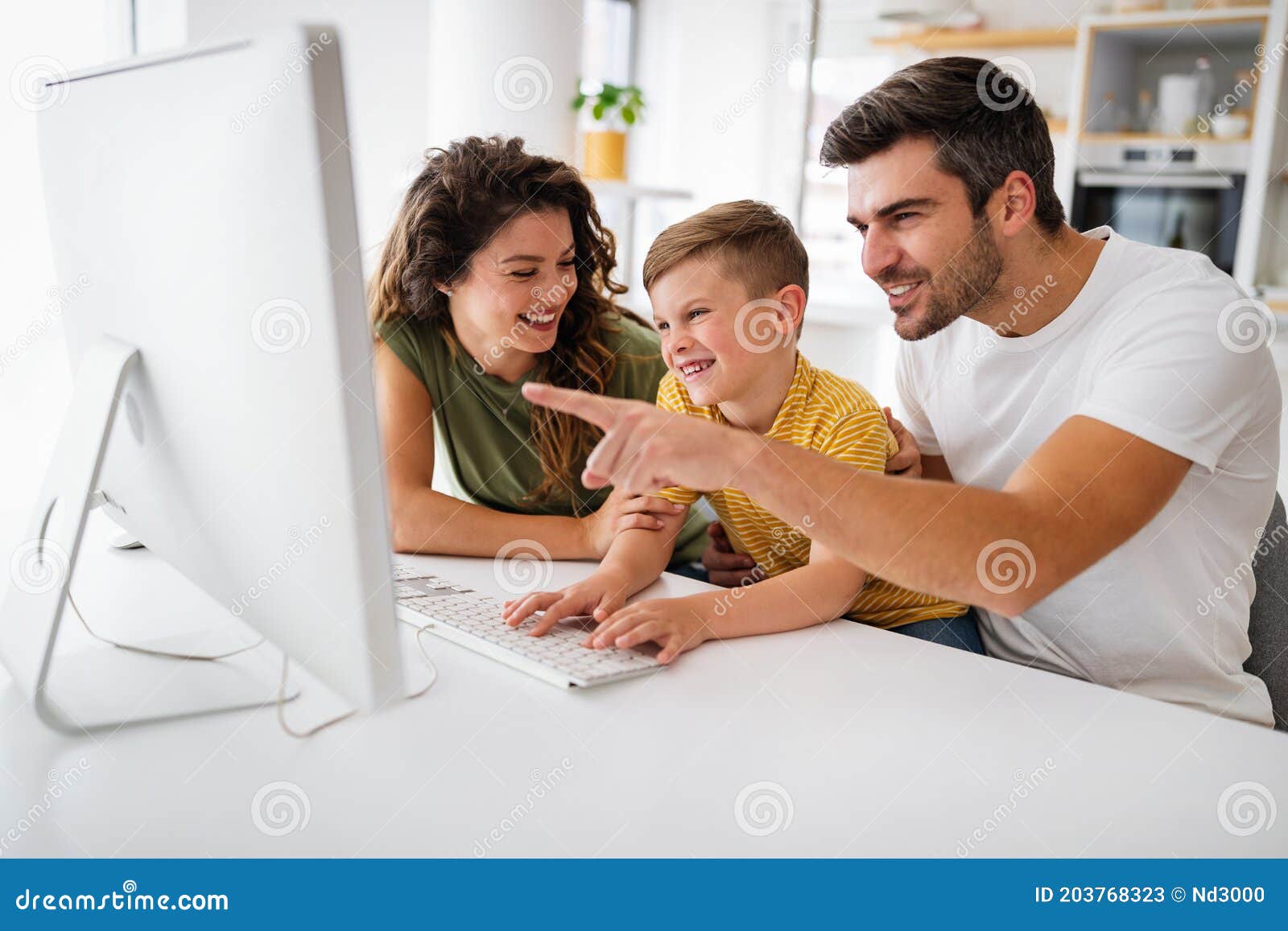 Happy Modern Family Using Computer Together at Home Stock Image - Image ...