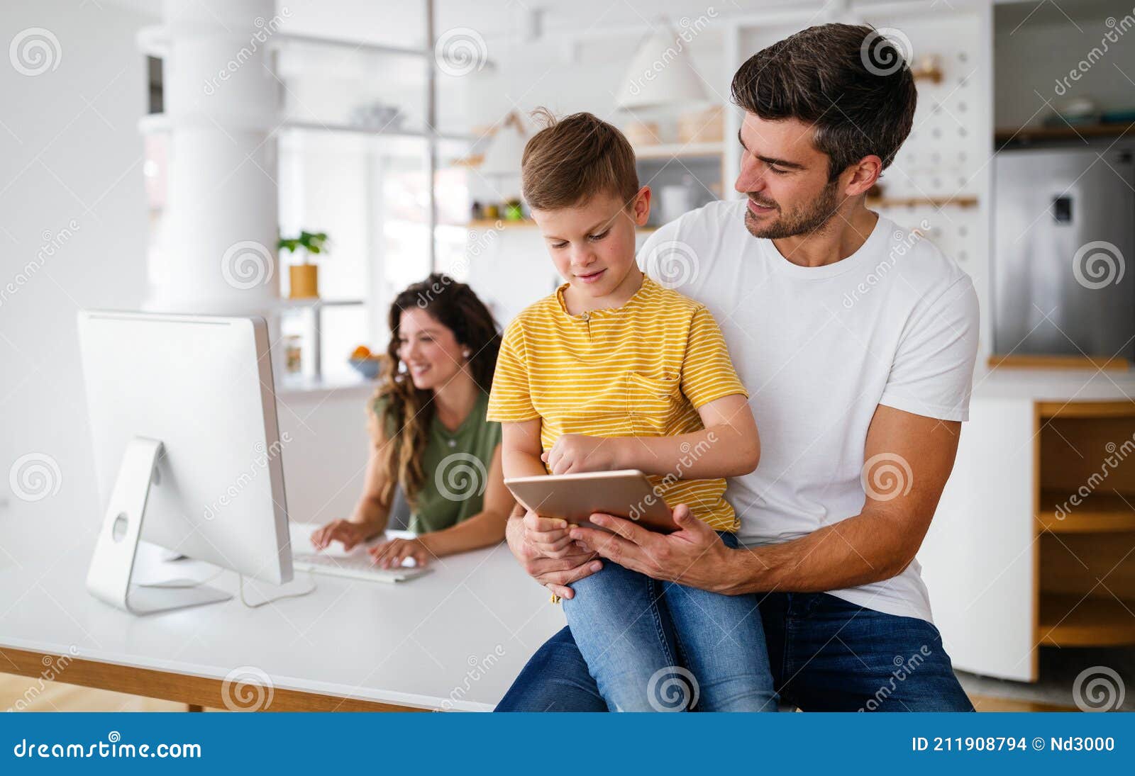 Happy Modern Family Using Computer Together at Home Stock Photo - Image ...