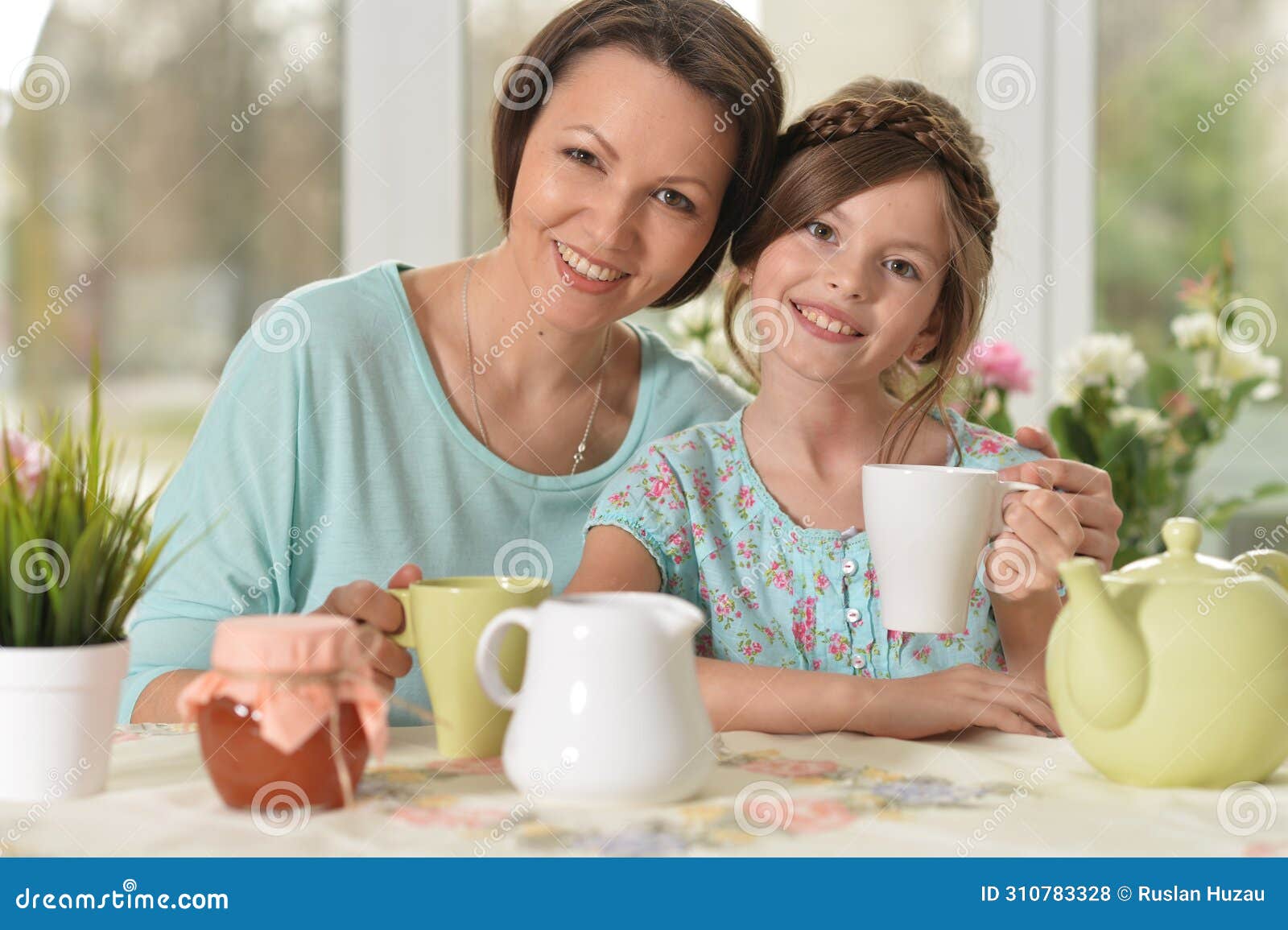 Happy Mom and Daughter Drinking Tea at Home Stock Photo - Image of ...