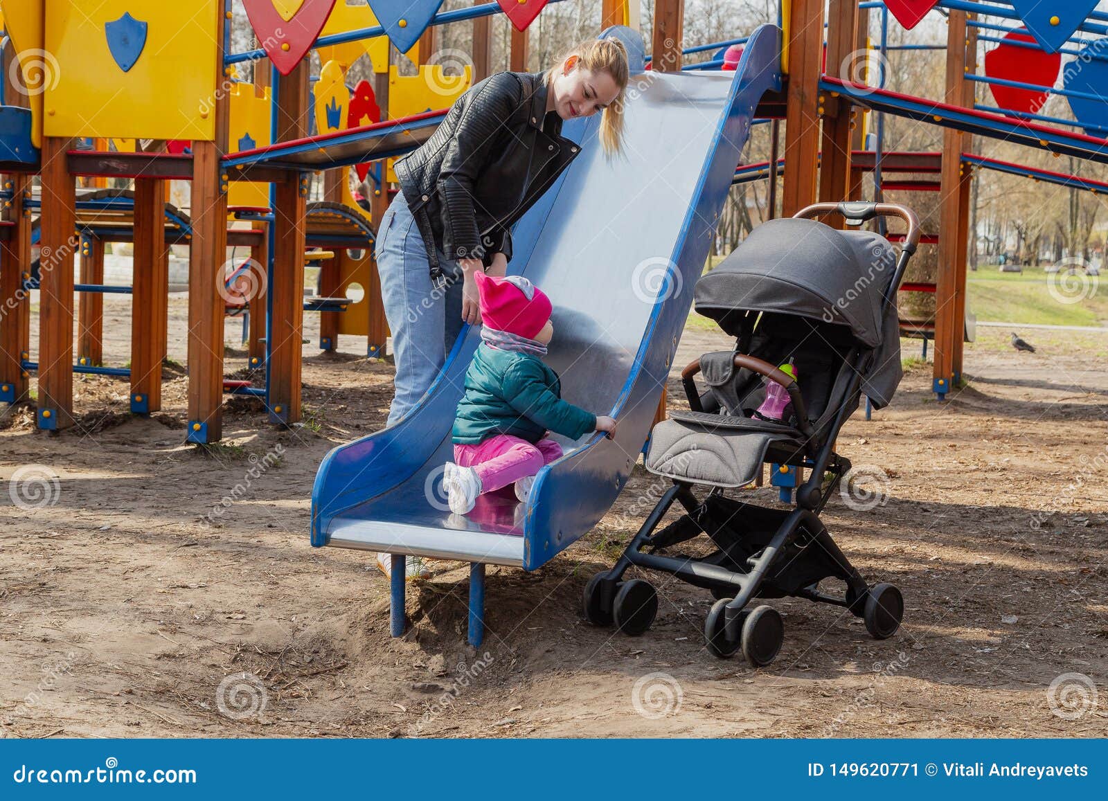 Happy Mom and Daughter Play on the Playground. Stock Image - Image of ...