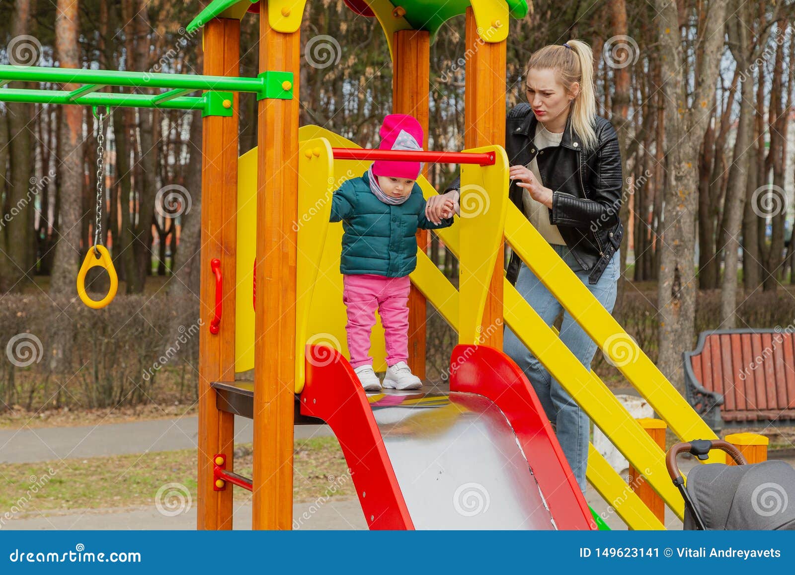 Happy Mom and Daughter Play on the Playground. Stock Image - Image of ...