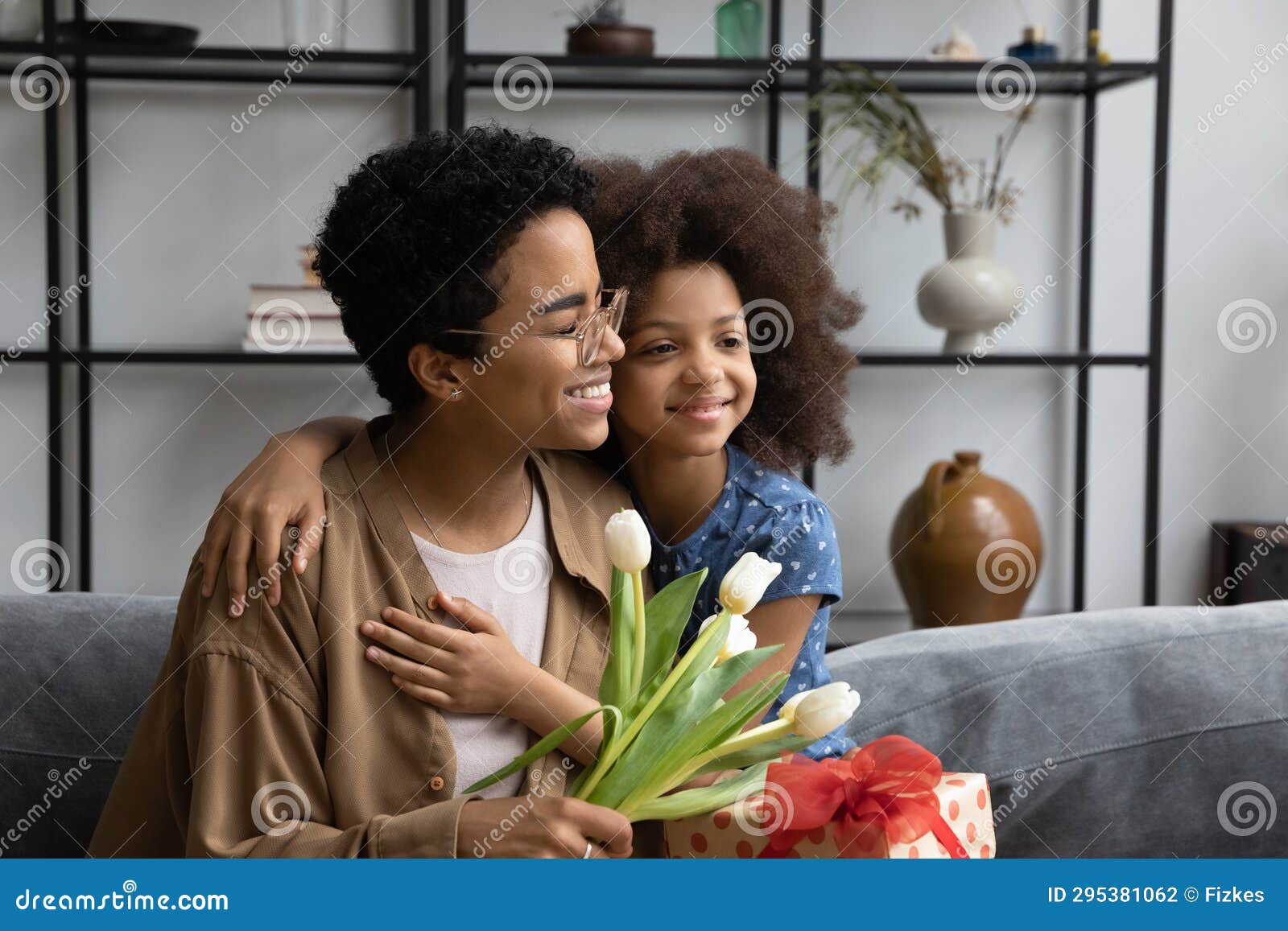 Happy Mom Receiving Gift and Bunch of Flowers from Daughte Stock Photo ...
