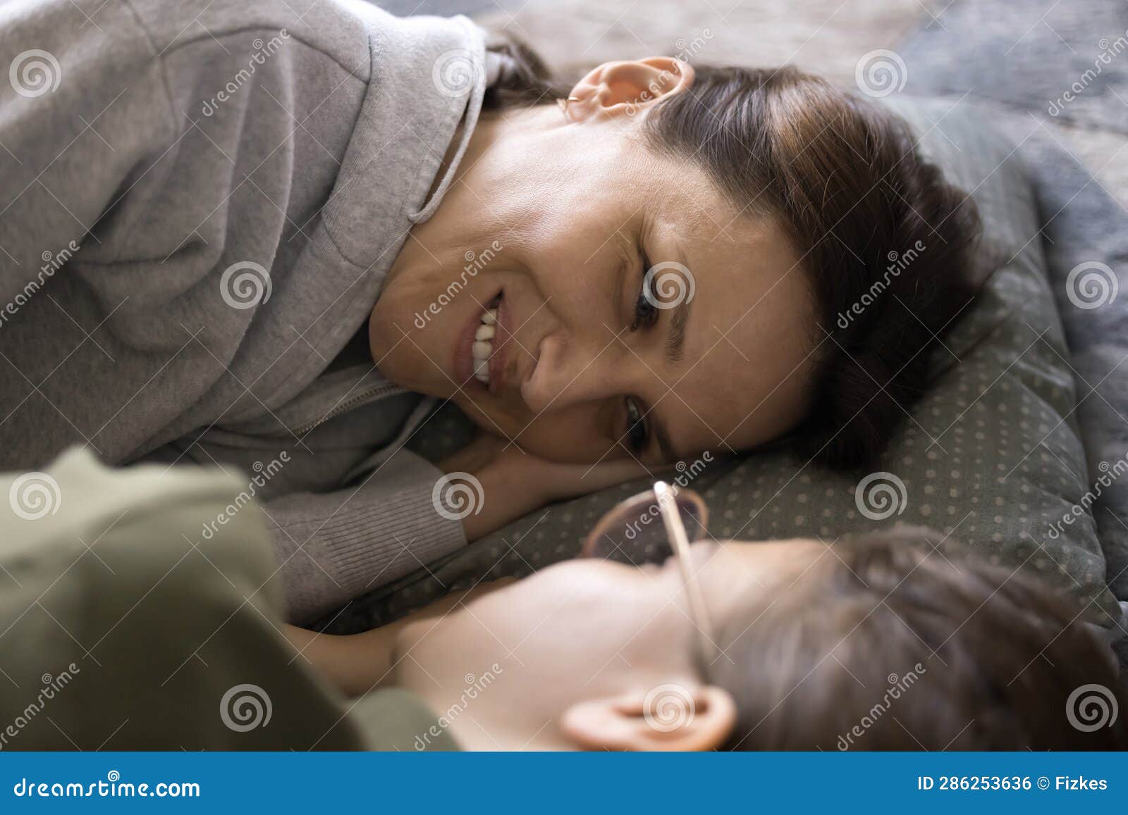 Happy Mom Resting in Bed, Talking with Teenager Stock Photo - Image of ...