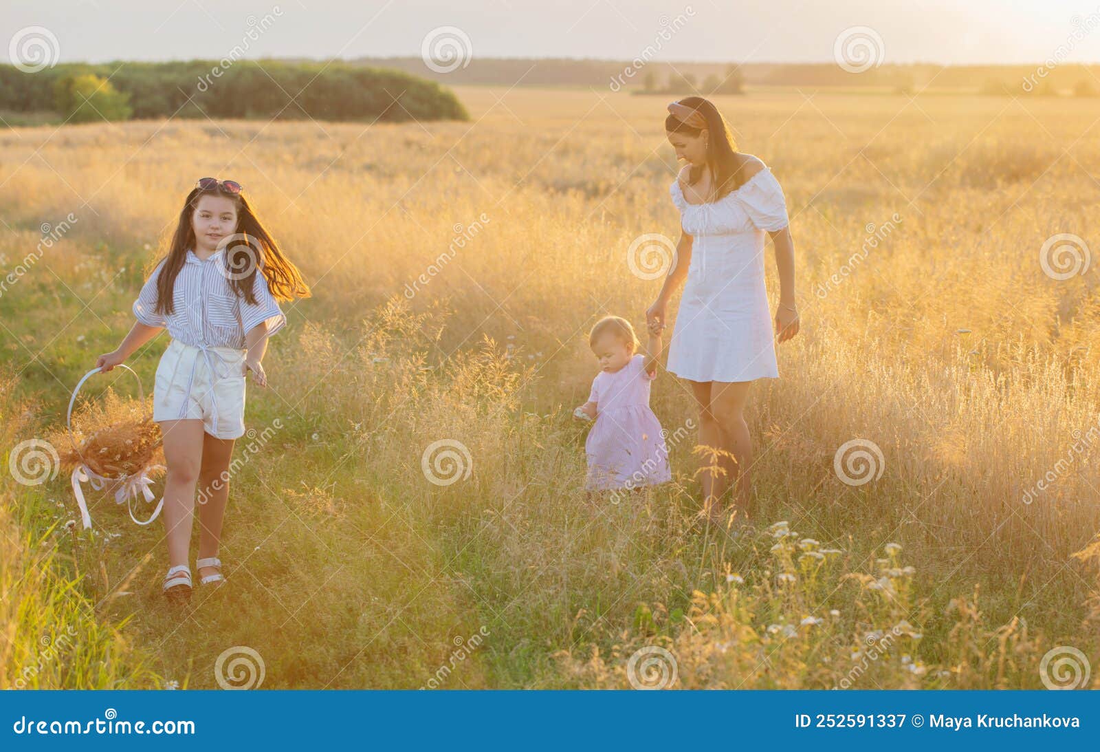 Mom with Two Little Daughters on Summer Field at Sunset Stock Image ...