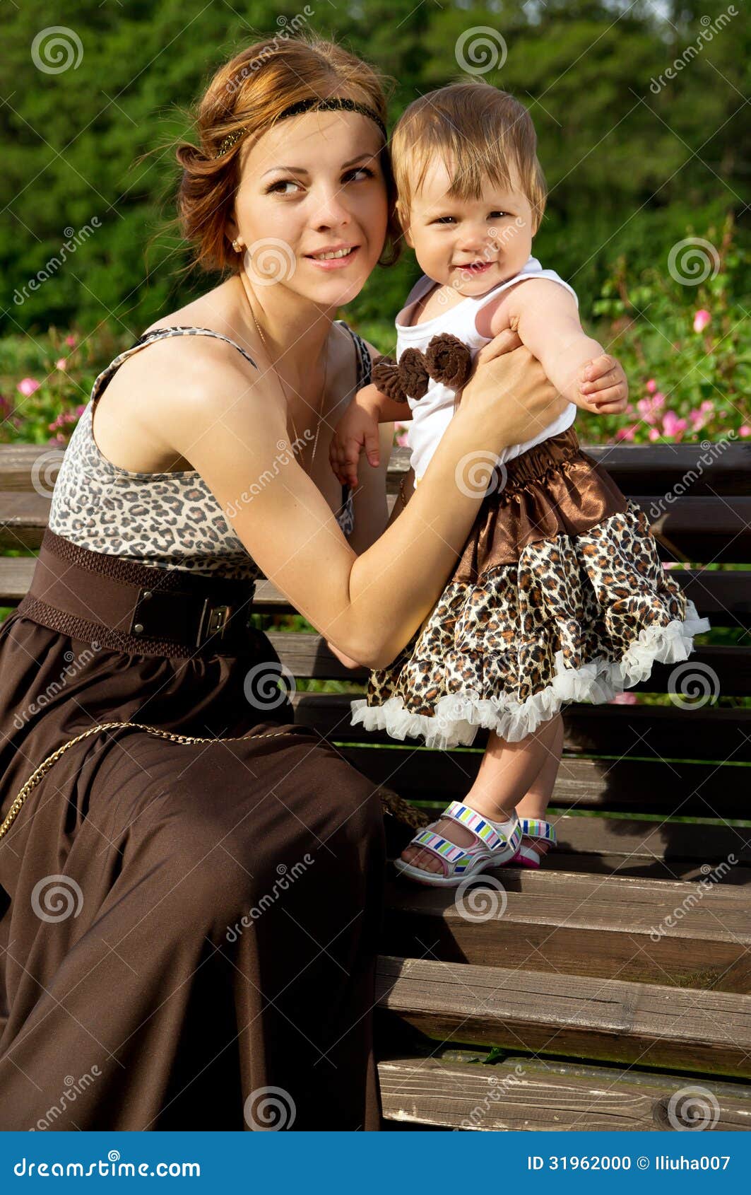 Happy Mother with a Baby on the Bench Stock Photo - Image of daughter ...