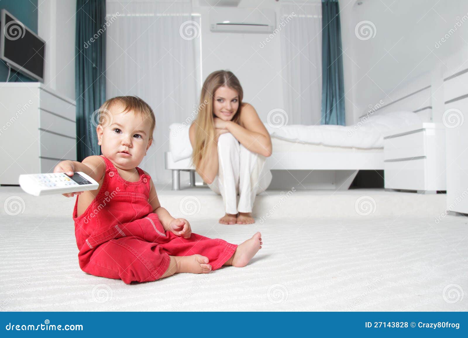 Happy Mother and Child with Remote Control Stock Photo - Image of ...