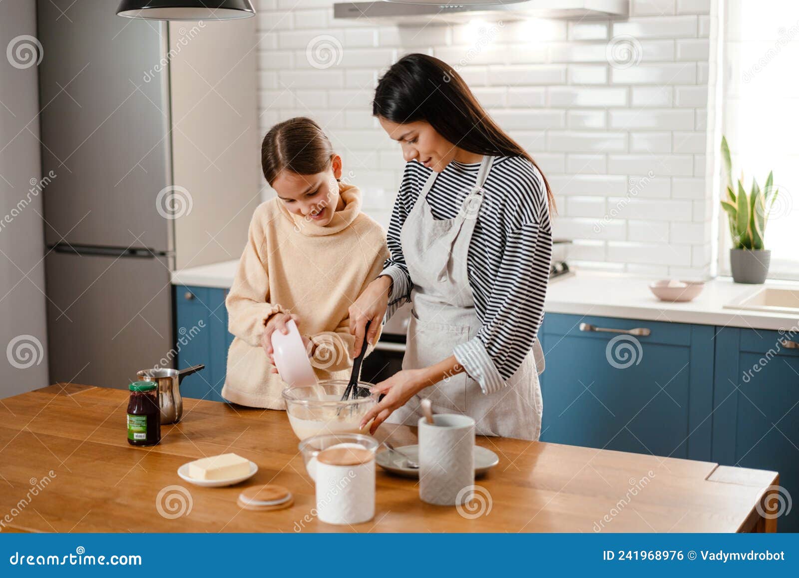 Happy Mother and Daughter Cooking Breakfast Together Stock Photo ...