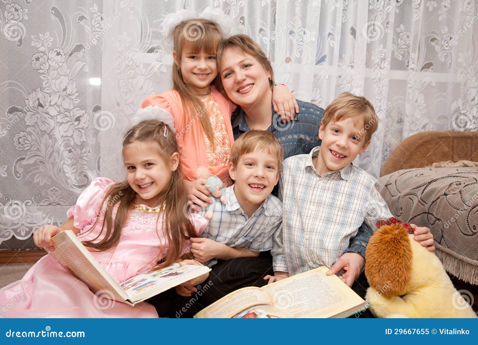 Happy Mother And Four Children Reading Book. Royalty Free Stock Photo ...