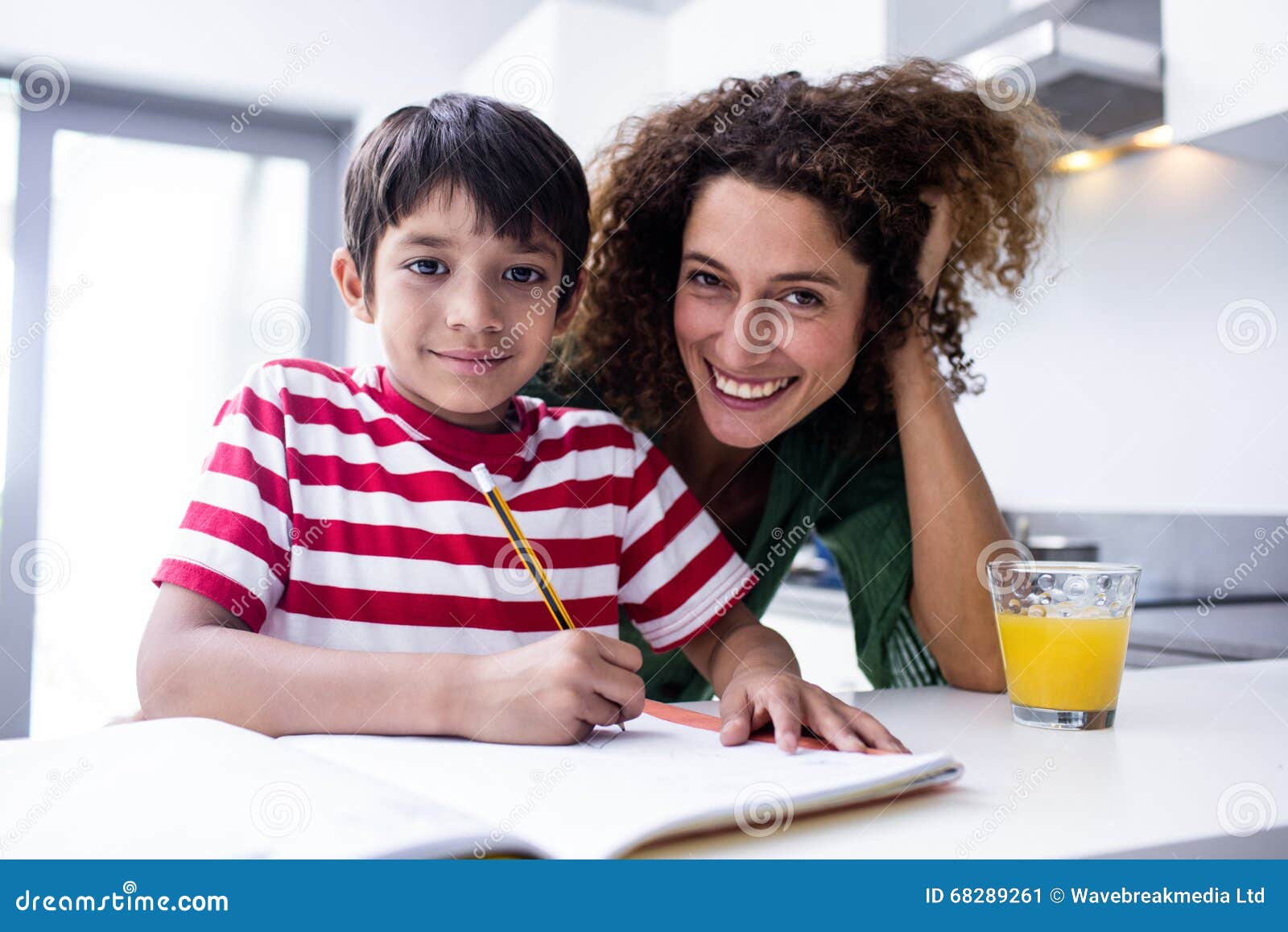 Happy Mother Helping Son with Homework Stock Image - Image of hand ...