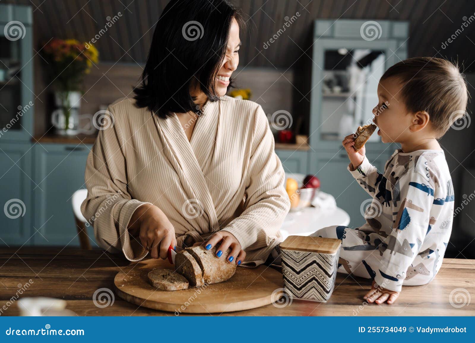 Happy Mother Making Fun with Her Son while Cutting Bread Stock Image ...