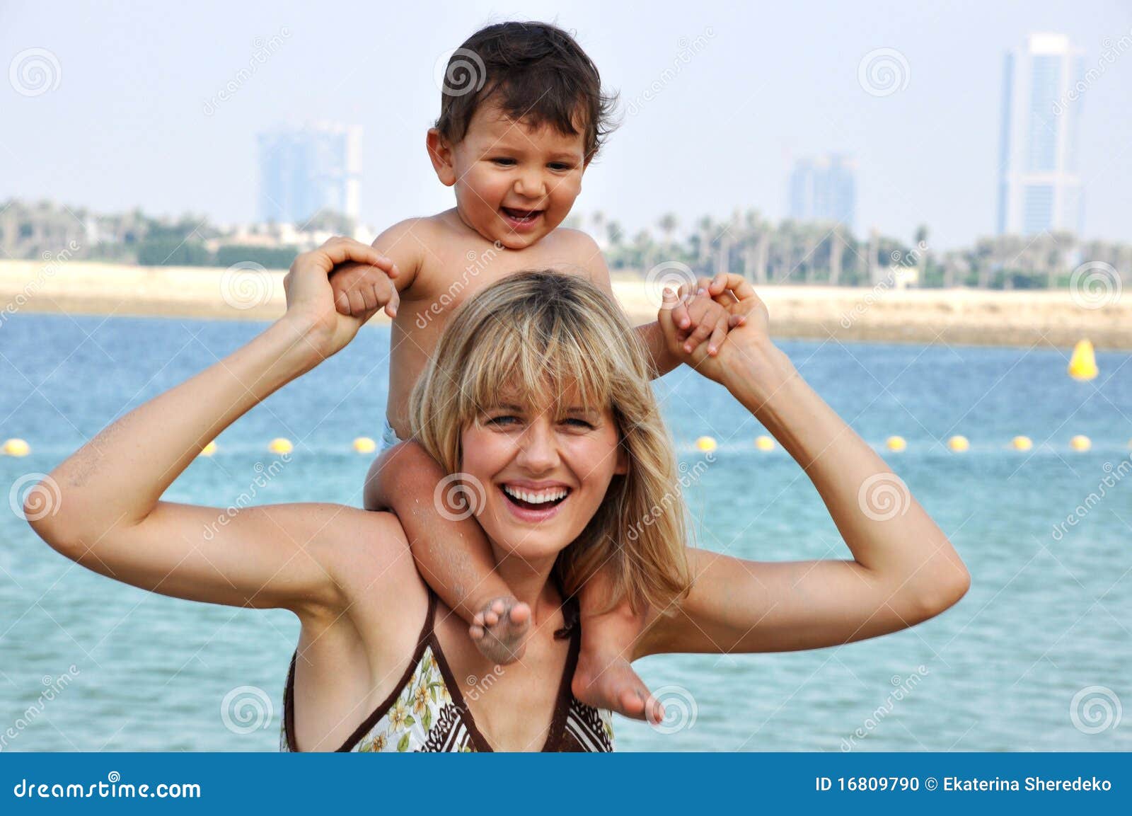 Happy Mother and Son Playing on the Beach Stock Photo - Image of family ... Happy Mother and Son Playing on the Beach Stock Photo - Image of family ...