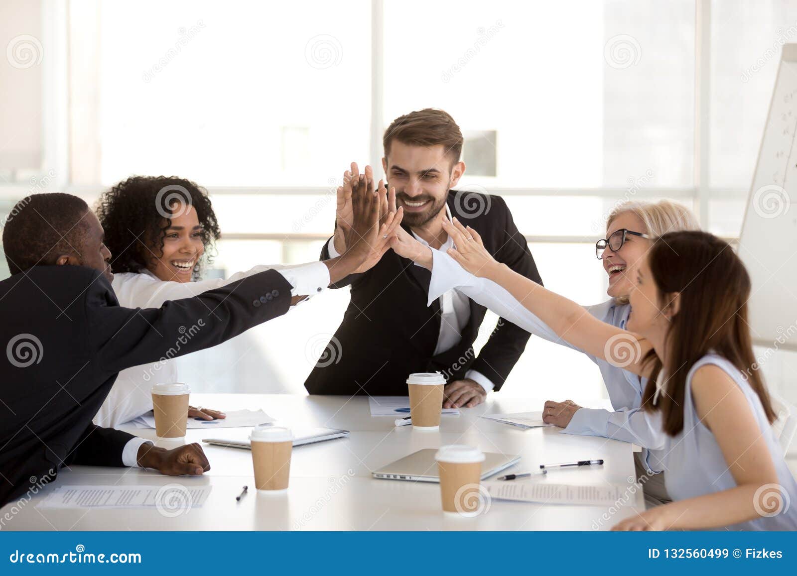 Happy Motivated Diverse Business Team People Giving High Five Stock