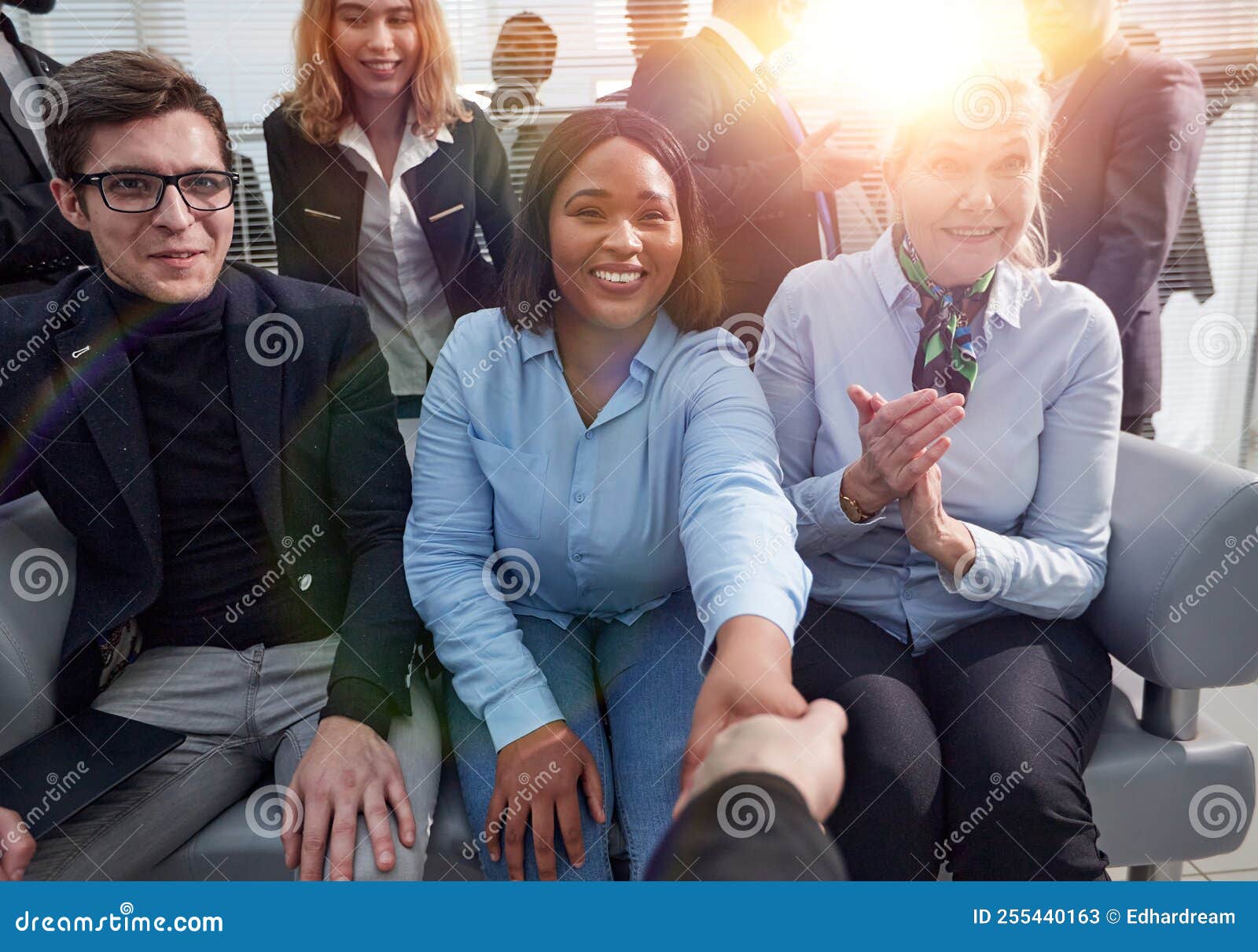 Happy Multi Ethnic Co-workers Handshaking in the Office Stock Image ...