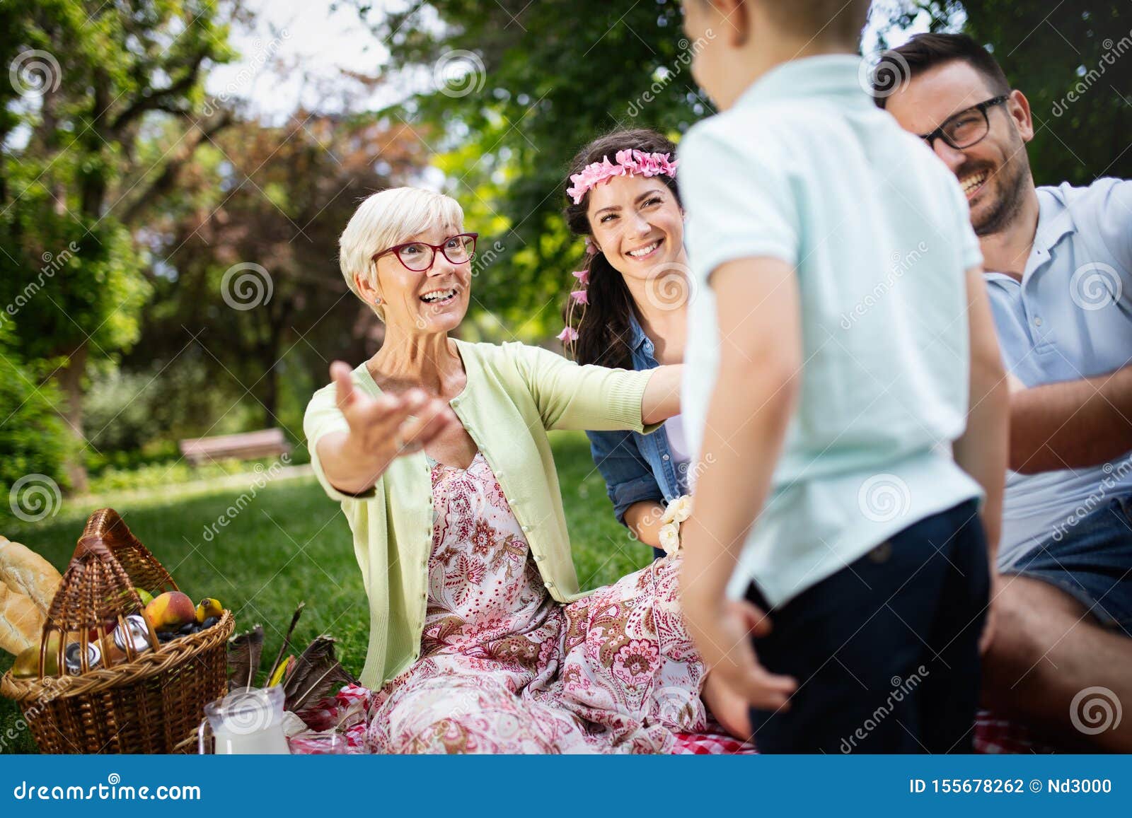 Multi Generation Family Enjoying Picnic in a Park Stock Photo - Image ... Multi Generation Family Enjoying Picnic in a Park Stock Photo - Image ...