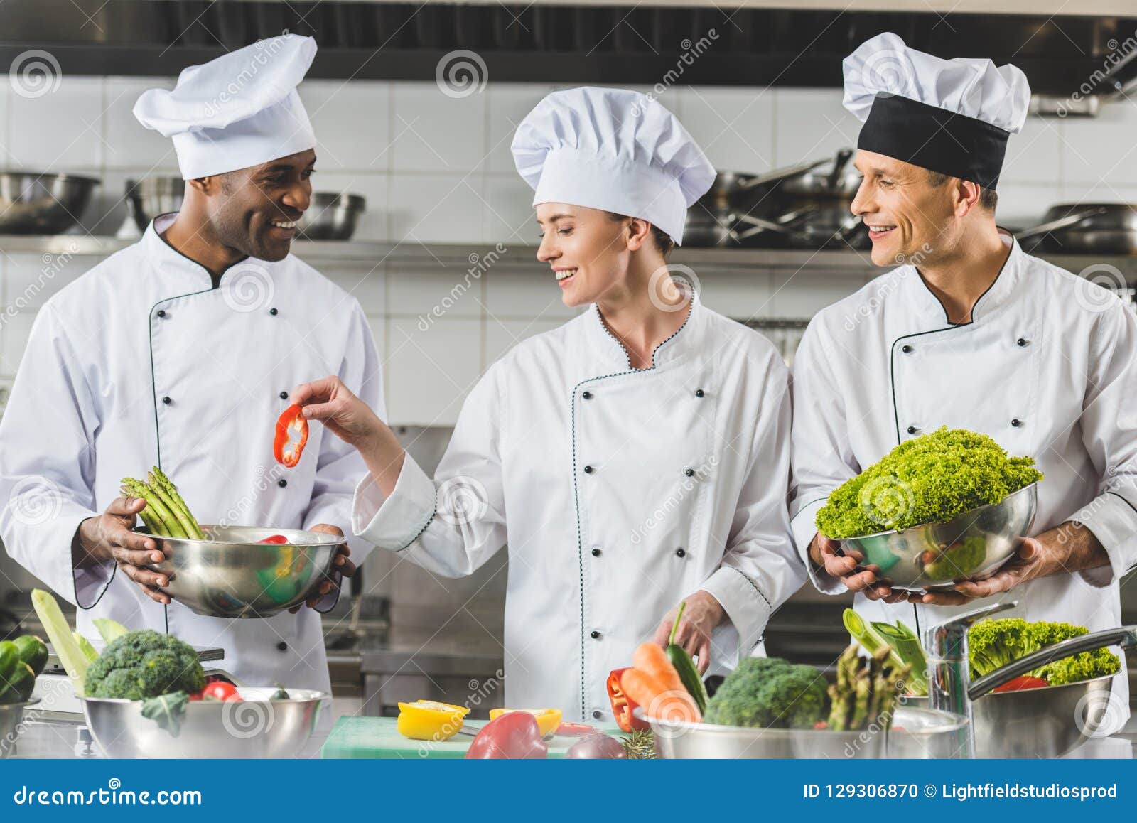 Happy Multicultural Chefs Cooking Vegetables Stock Photo - Image of ...