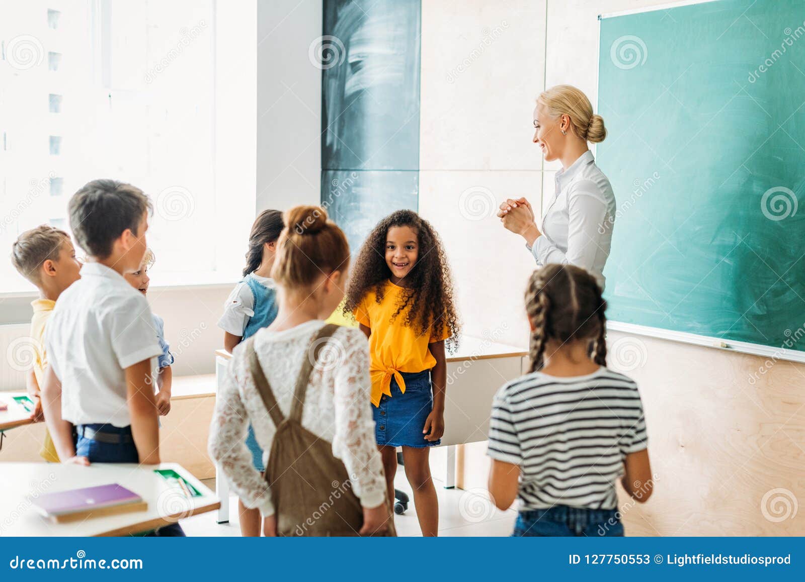 Happy Multiethnic Classmates Standing Around Teacher Stock Image ...