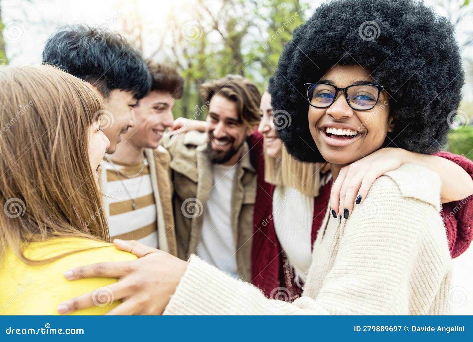 Happy Multiracial Friends Hugging Together Outside International