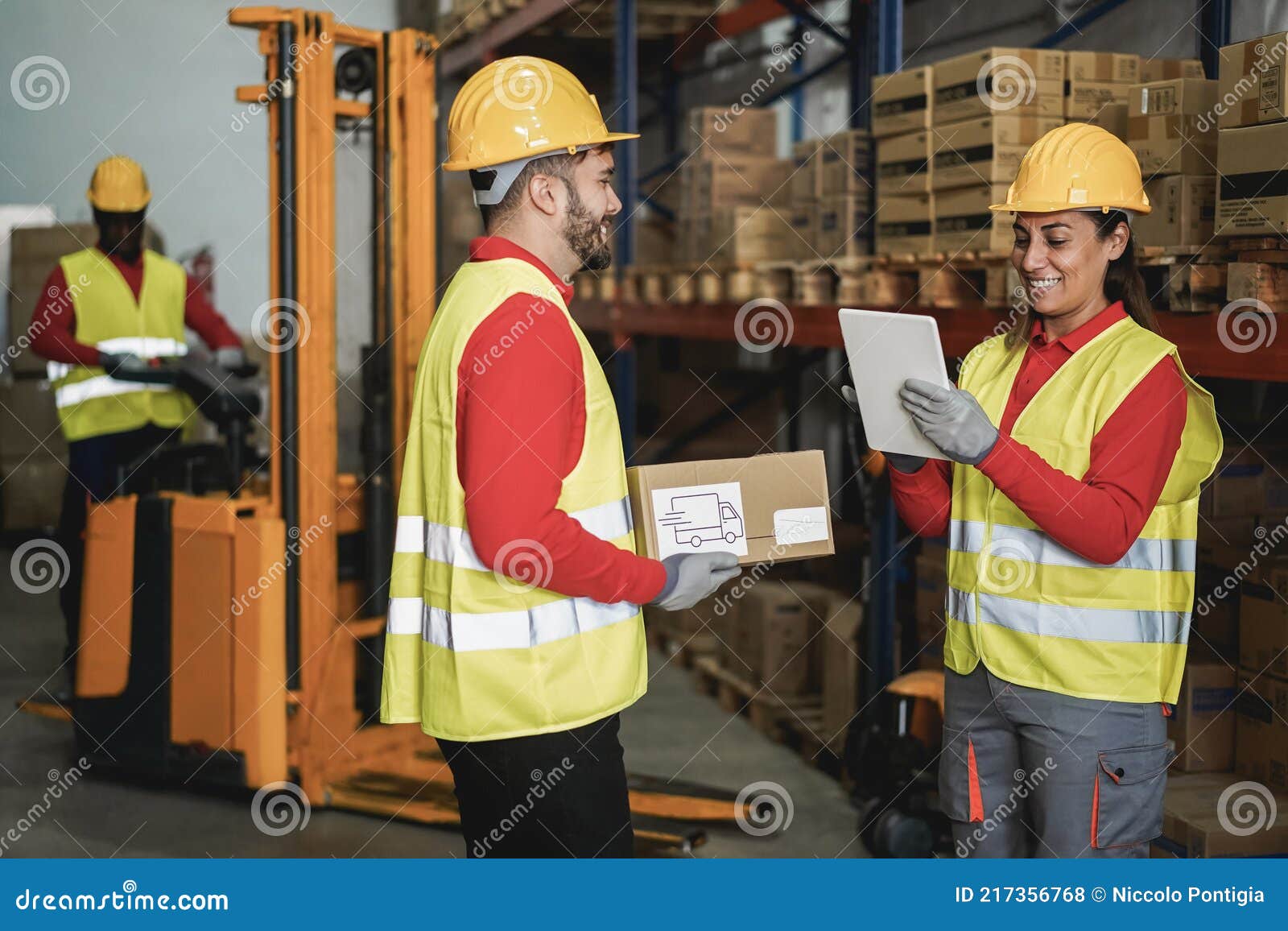 Happy Multiracial Workers Talking Inside Warehouse Store - Focus on ...