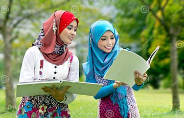 Happy muslim students stock image. Image of grass, islamic - 21452145