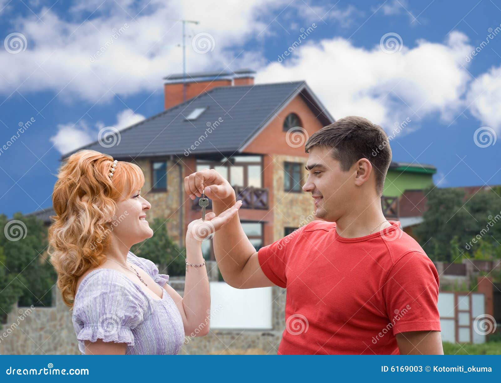 Happy new homeowners stock image. Image of construction - 6169003