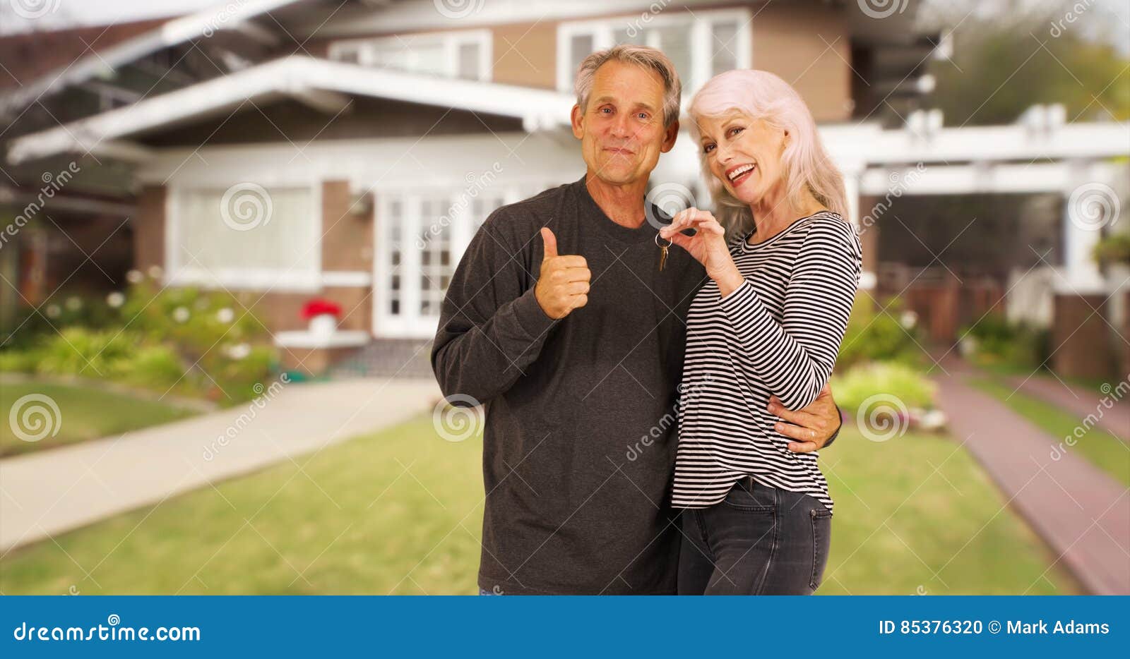 Happy New Senior Homeowners Smiling at Camera Stock Photo - Image of ...