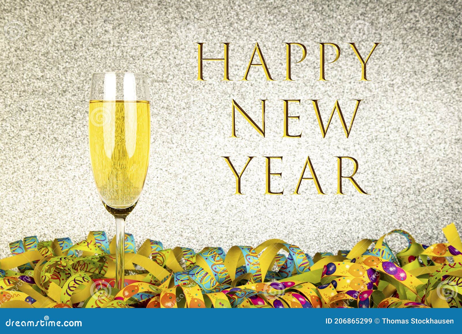 Happy New Year Card With A Glass Of Sparkling Wine A Streamer As A Background And A Silver