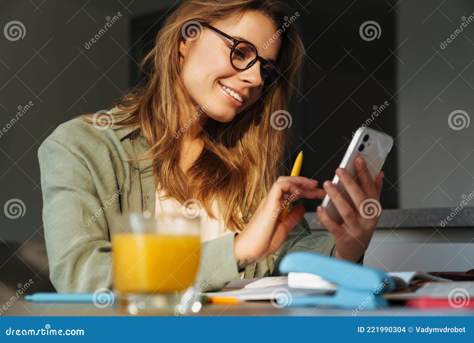 Happy Nice Student Woman Using Mobile Phone while Doing Homework Stock ...