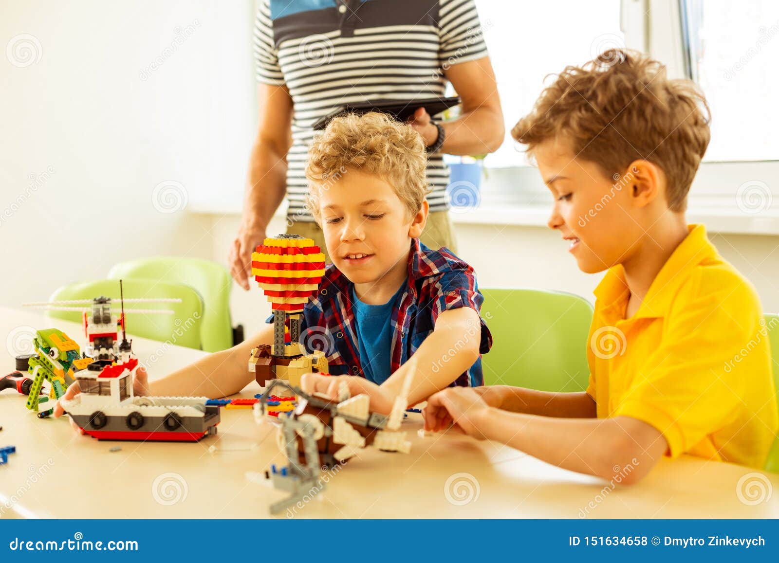 Happy Nice Young Boys Constructing Toys Together Stock Photo - Image of ...