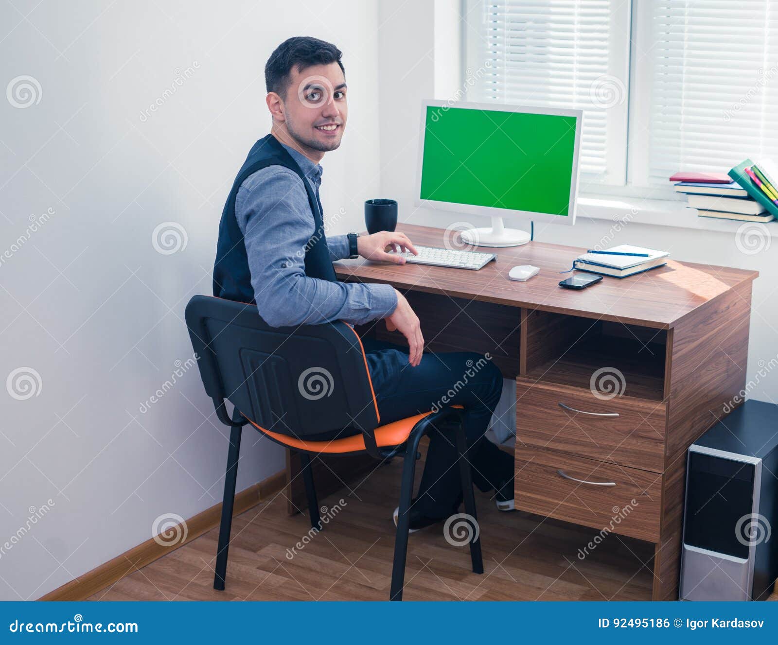 Happy Office Worker Smiling and Looking at the Camera Stock Photo ...