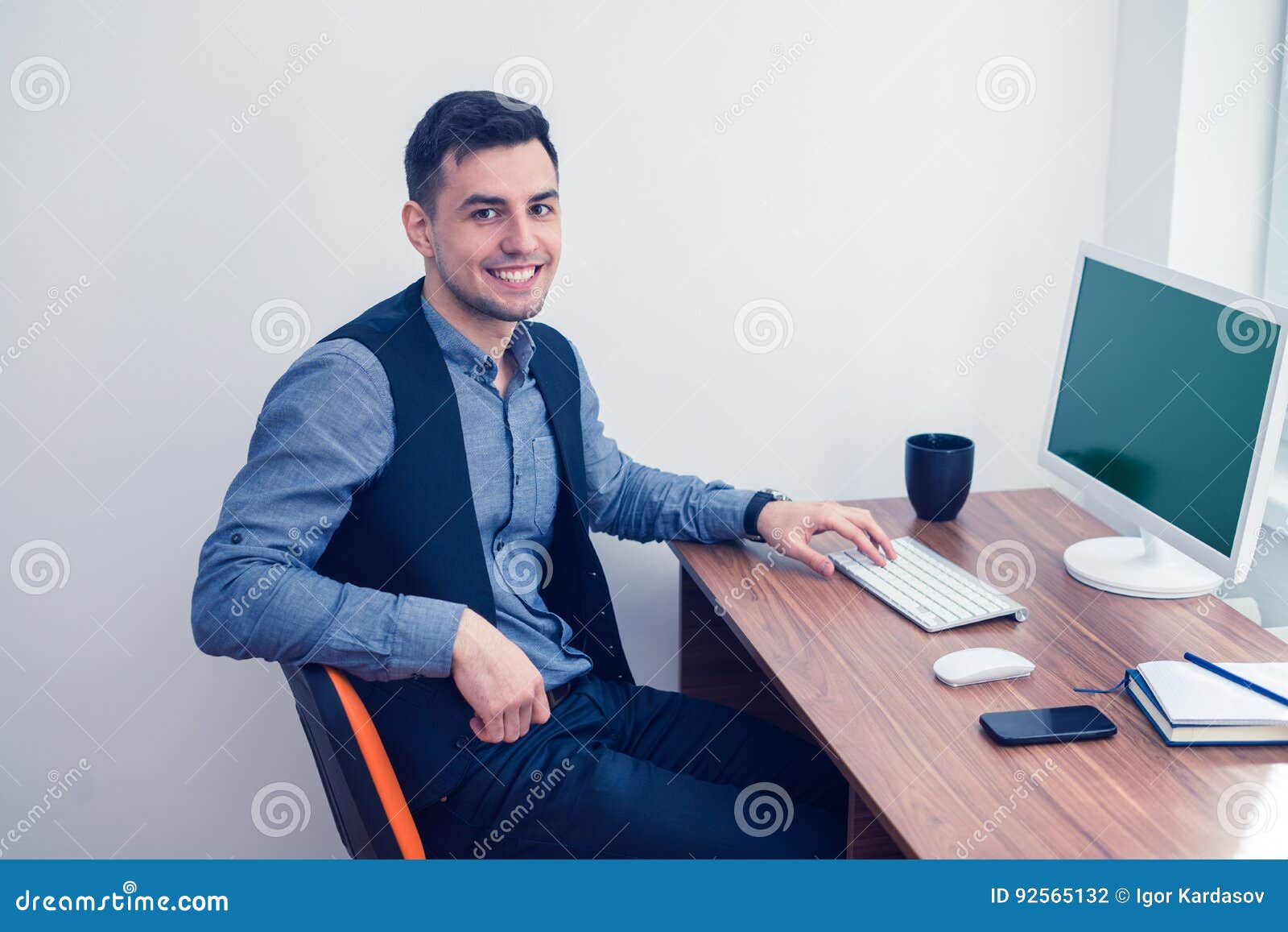 Happy Office Worker Smiling and Looking at the Camera Stock Photo ...