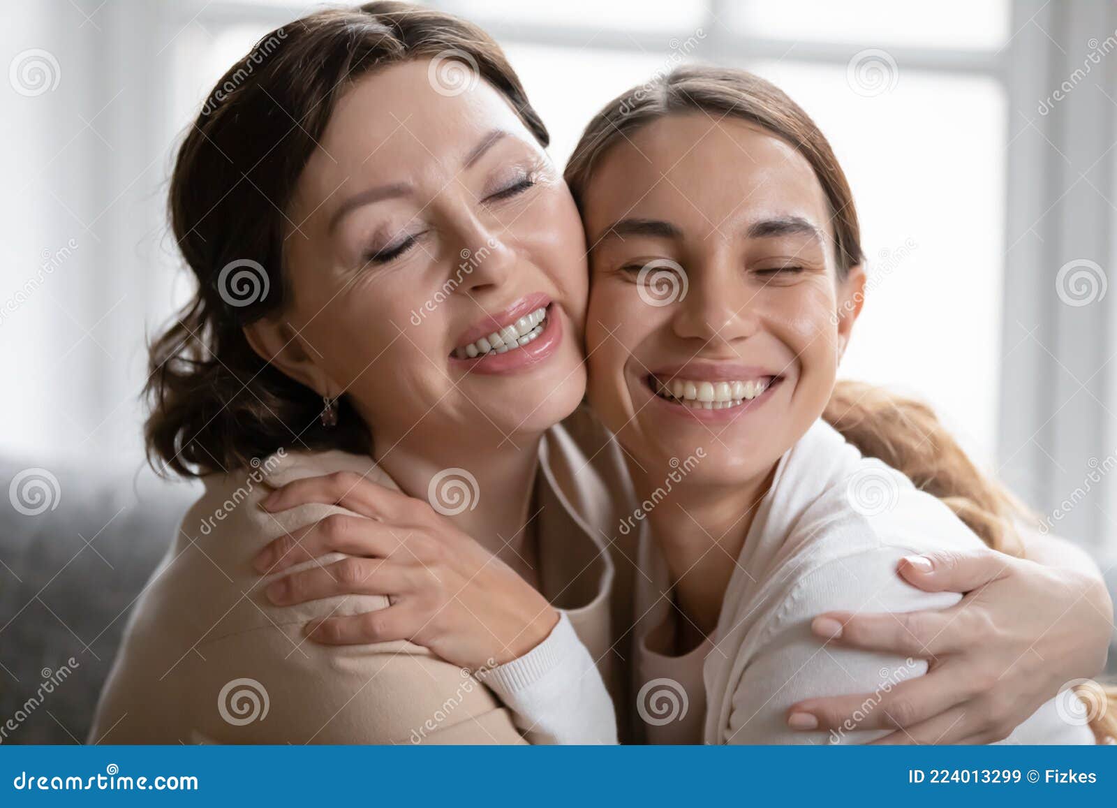 Happy Older Mom And Adult Daughter Hugging At Home Stock Image Image