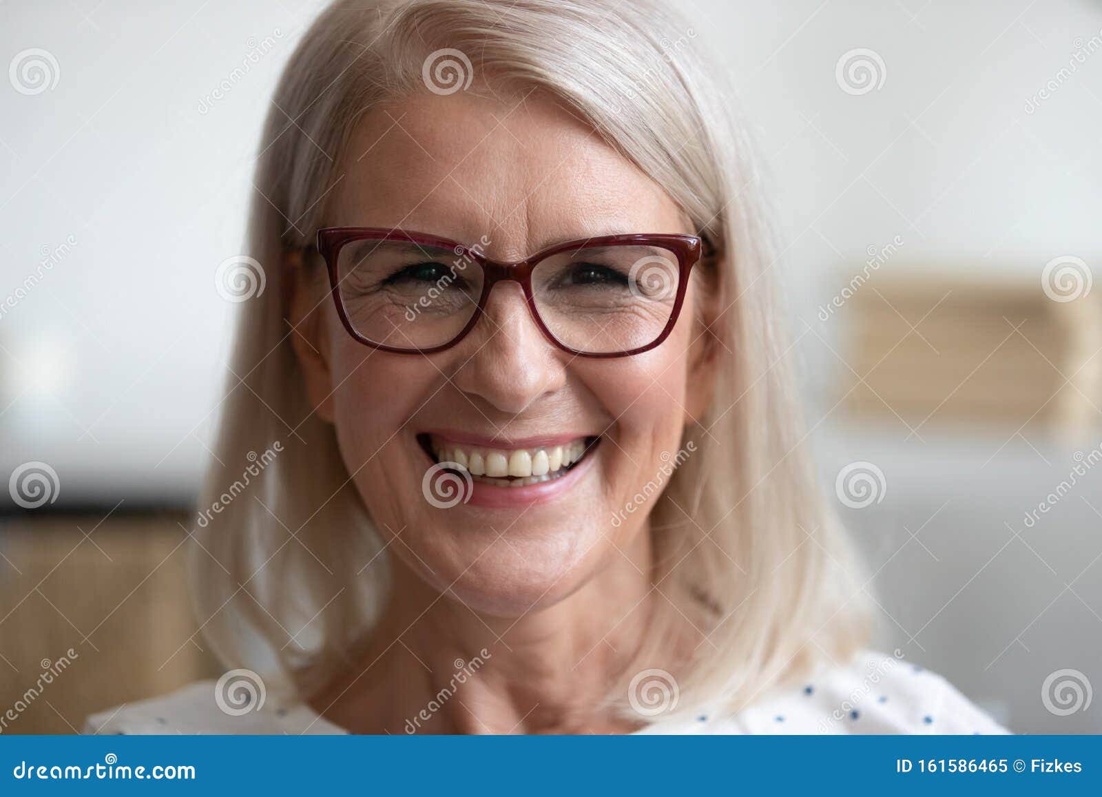 Happy Older Woman Looking At Camera At Home Closeup Portrait Stock