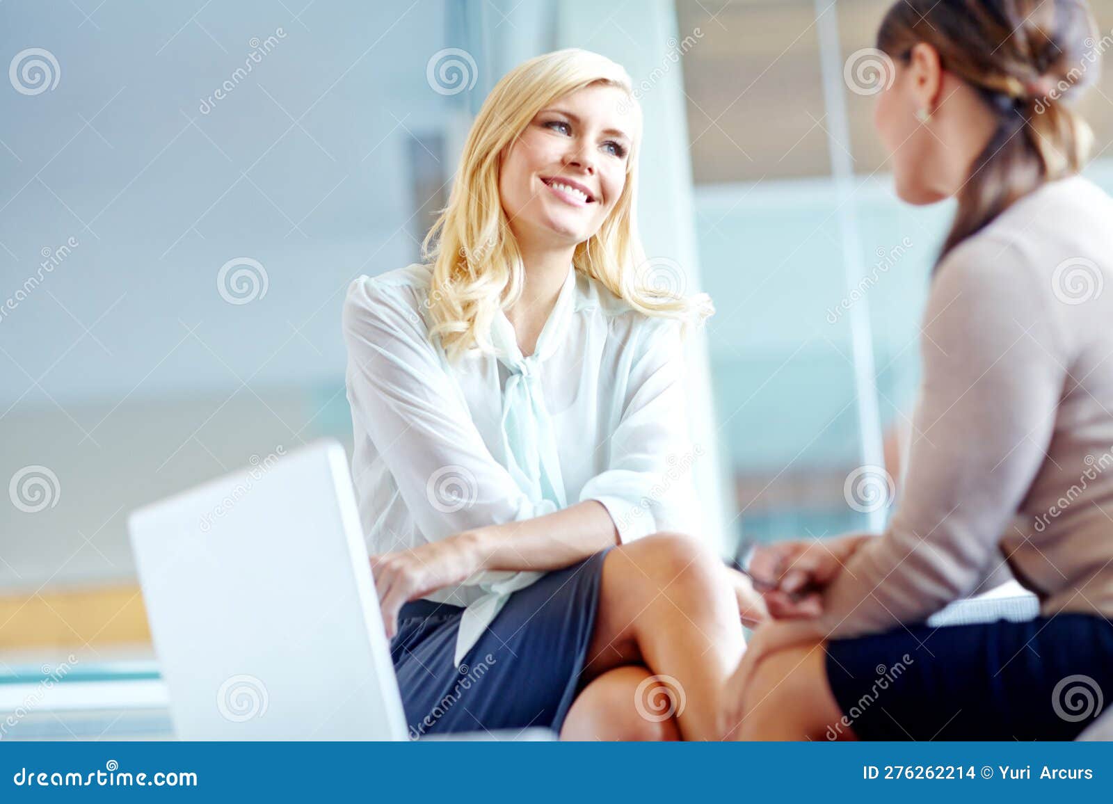 Happy with Our Work. Two Corporate Women in a Friendly Discussion with ...