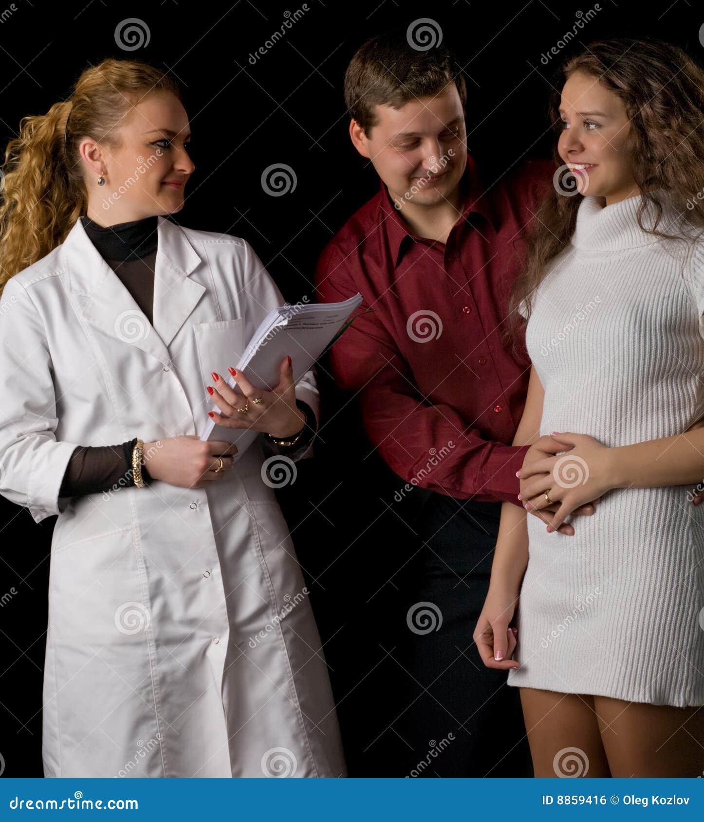 Happy pair and doctor stock photo. Image of paternity - 8859416
