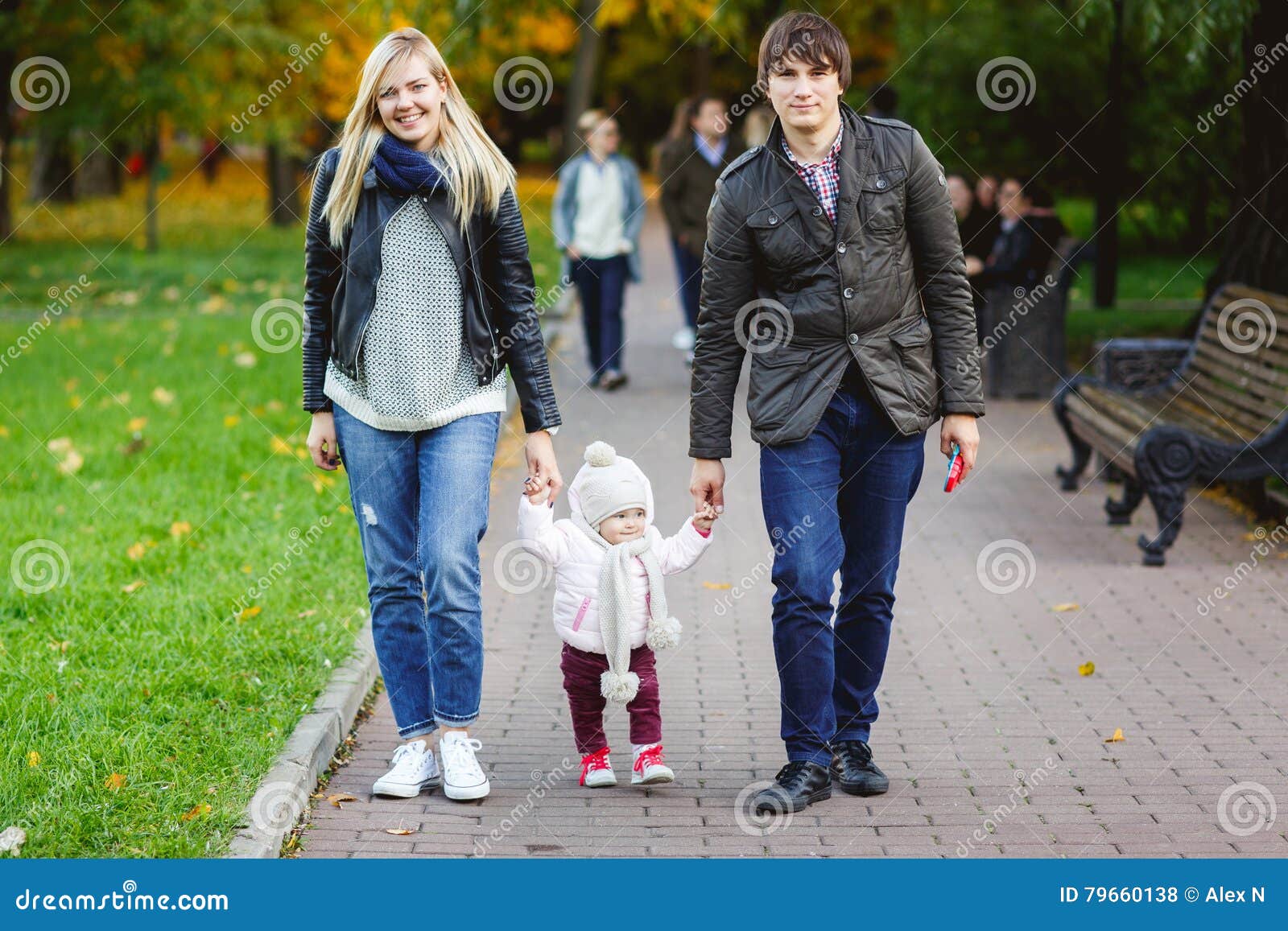 Happy Parents with Daughter Going on Path in Park Stock Photo - Image ...