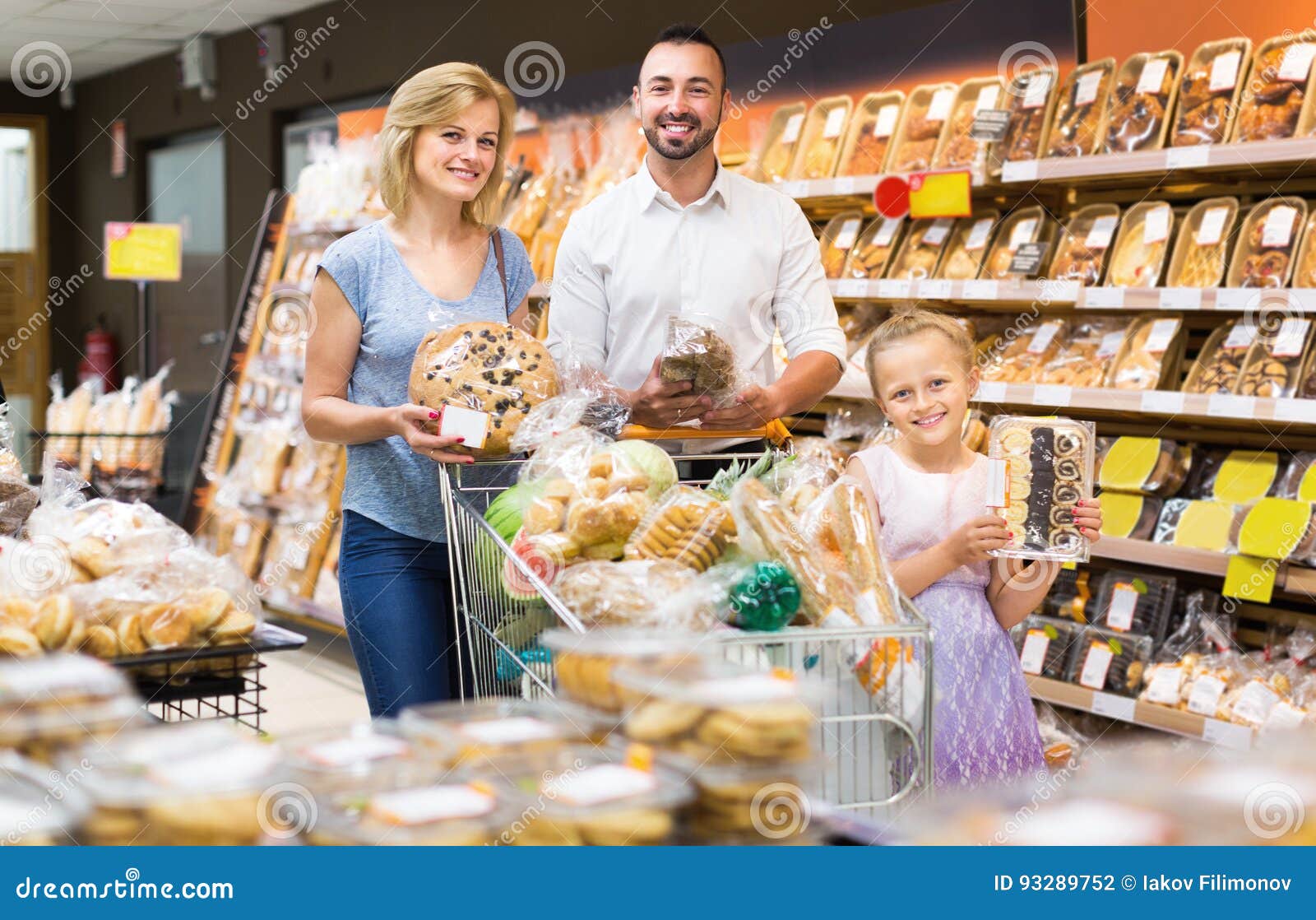 Happy Parents with Daughter Selecting Bread Stock Photo - Image of ...