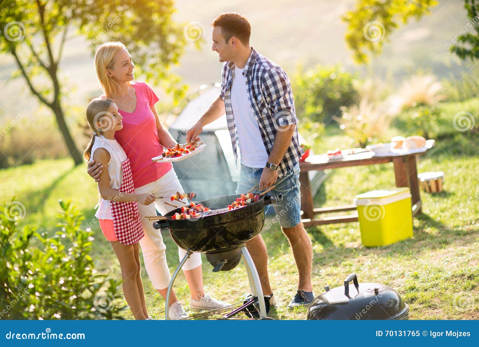 Happy Parents Grilling Meat with Daughter Stock Image - Image of family ...