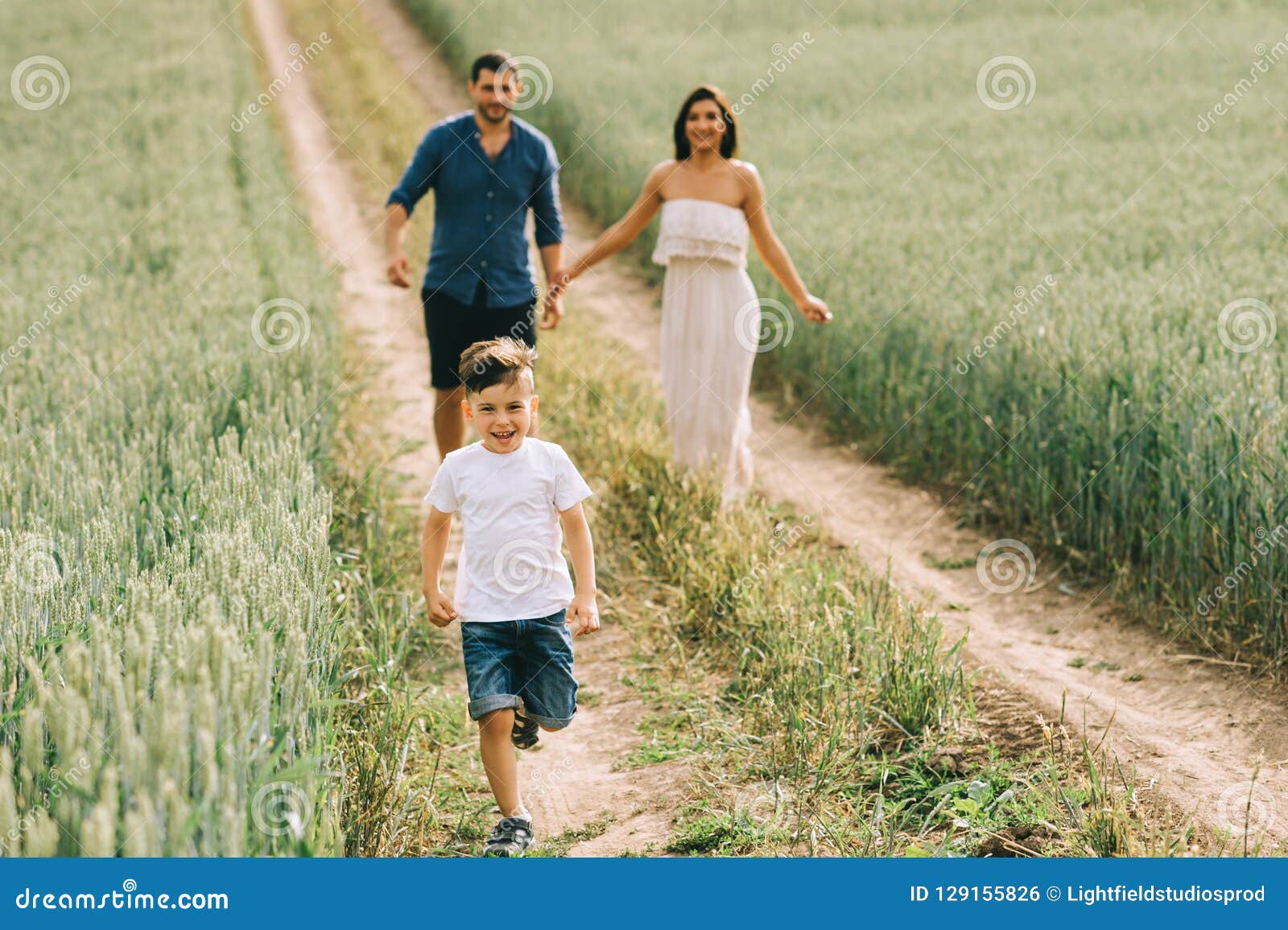 Happy Parents and Son Running on Path Stock Photo - Image of running ...