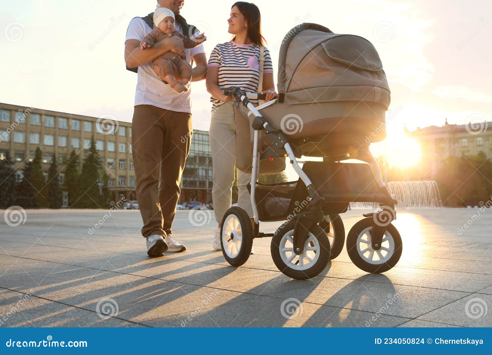 Happy Parents Walking with Their Baby Outdoors Stock Photo - Image of ...