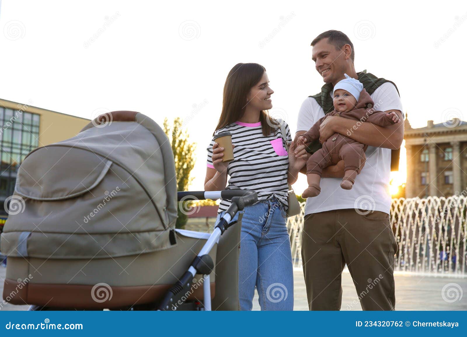 Happy Parents Walking with Their Baby Outdoors Stock Photo - Image of ...