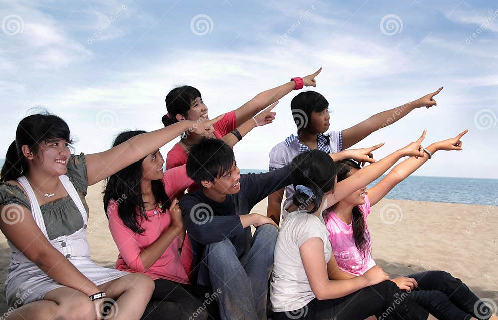 Happy people at beach stock photo. Image of pointing, groups - 9479964