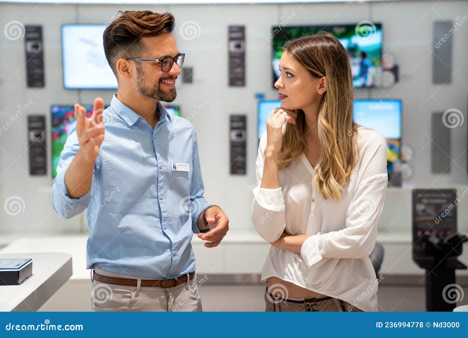 Happy People in Consumer Electronics Retail Store Looking at New ...